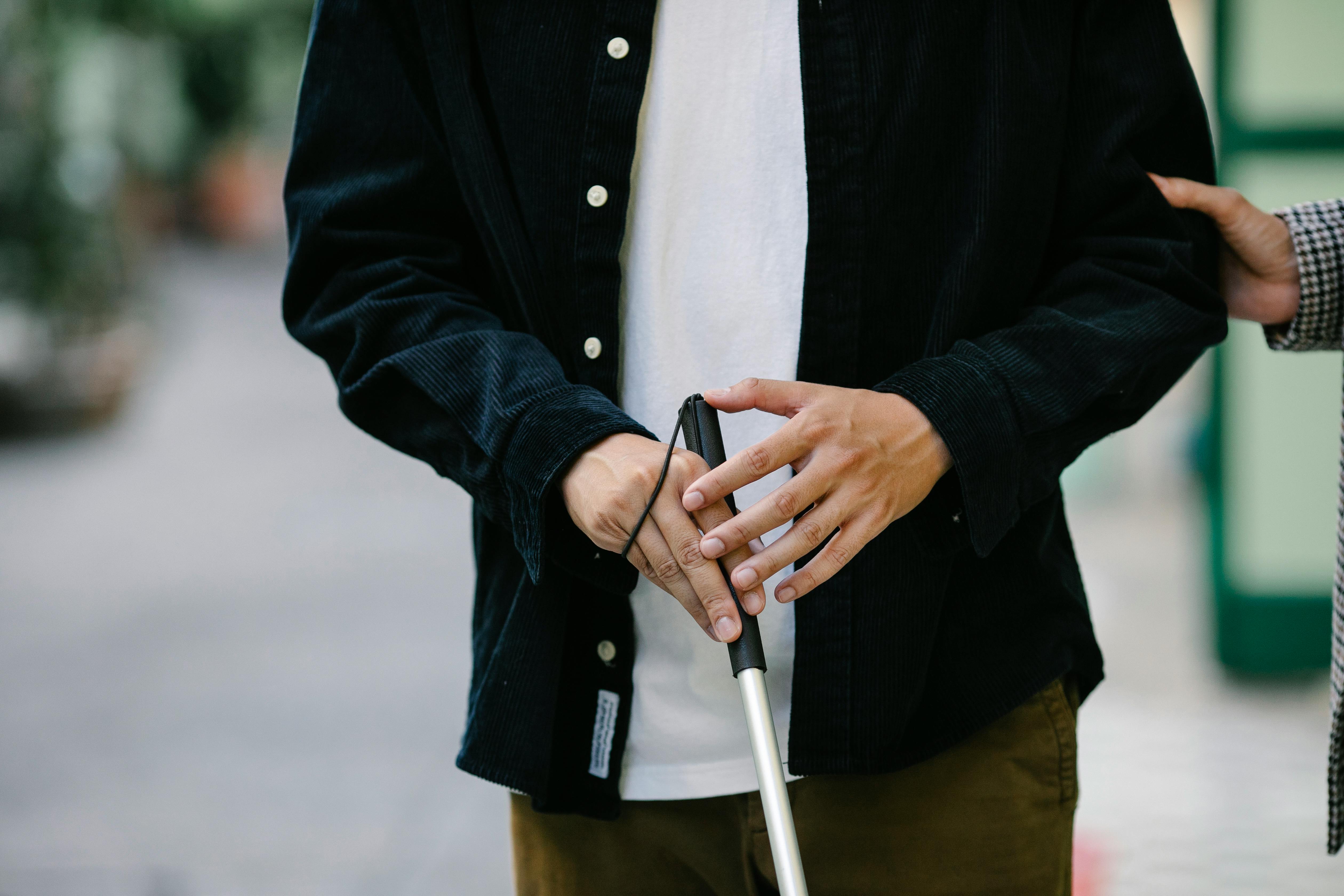 Photo of Man Holding A Walking Stick · Free Stock Photo