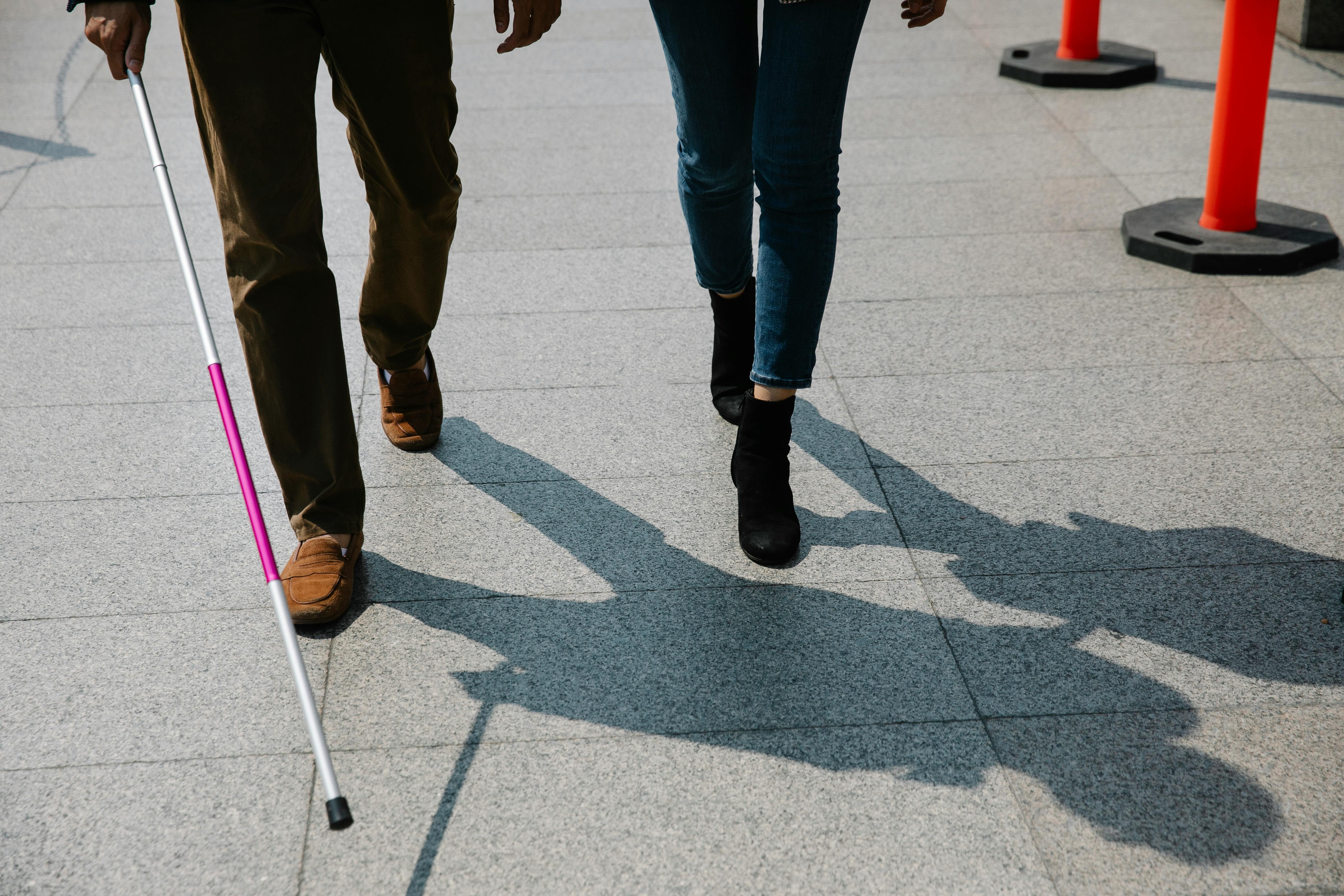 Photo of People Walking on Pavement · Free Stock Photo