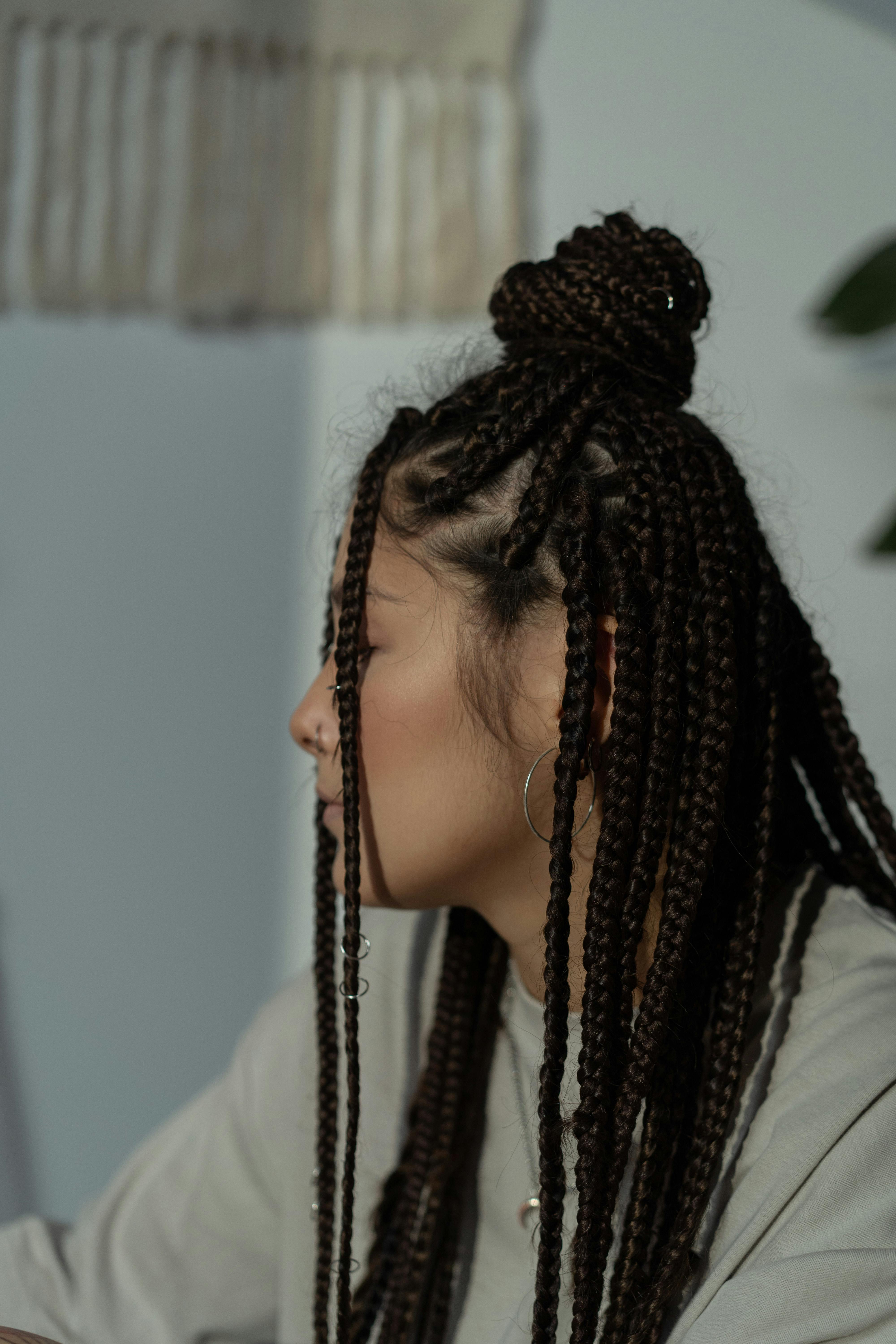 Side Profile Shot of a Woman with Braided Hair · Free Stock Photo