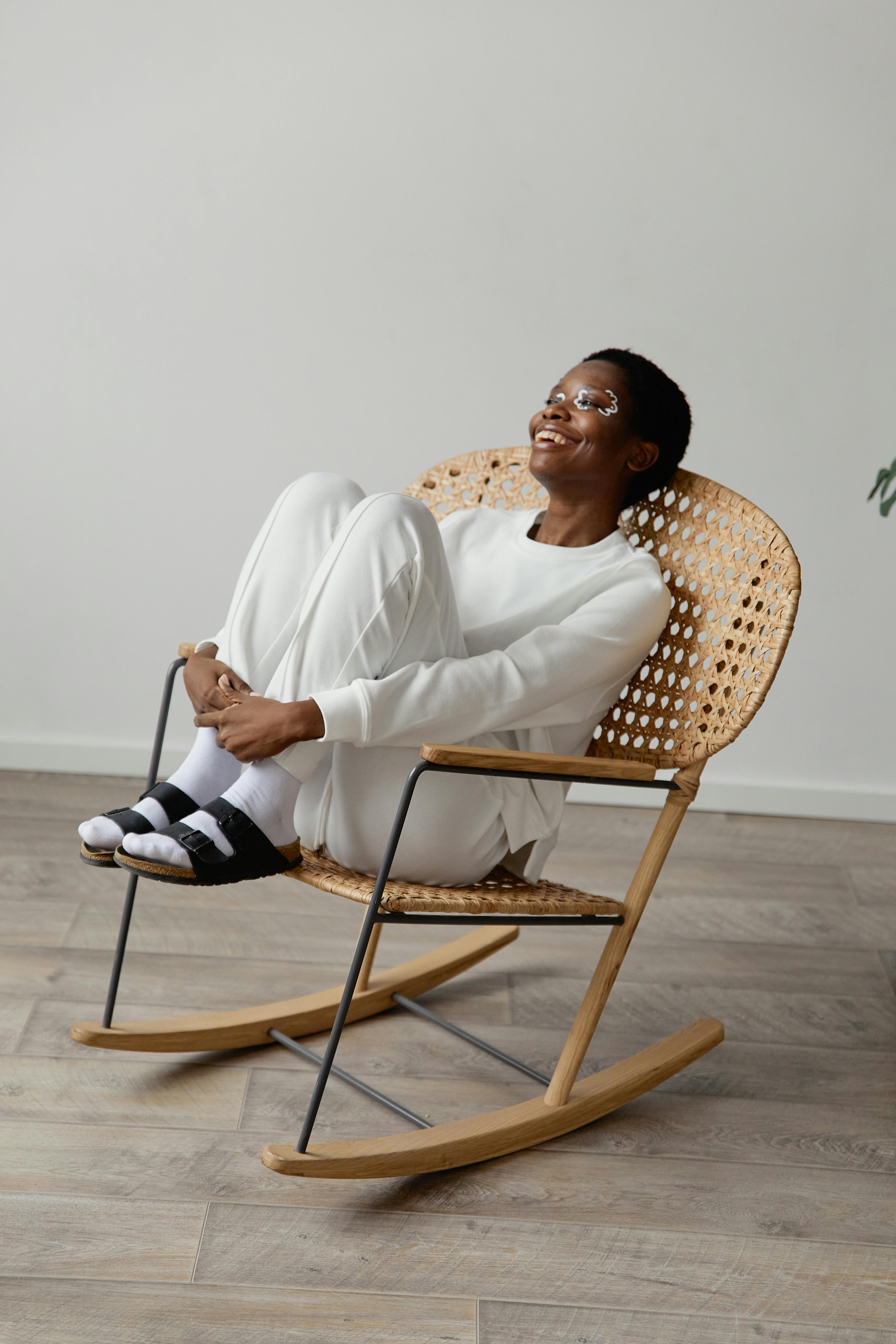 Pensive Woman in Rocking Chair · Free Stock Photo