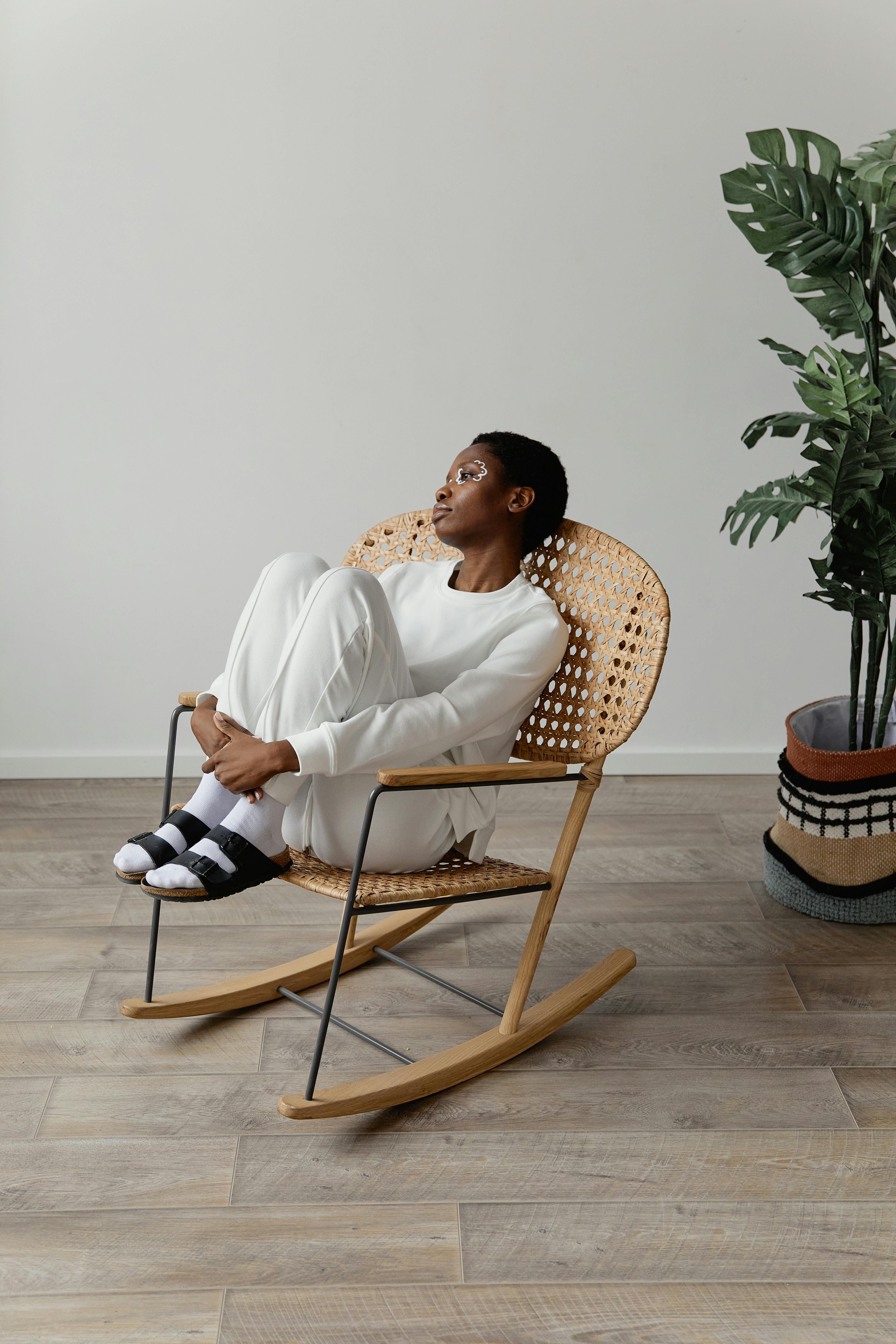 Pensive Woman in Rocking Chair · Free Stock Photo