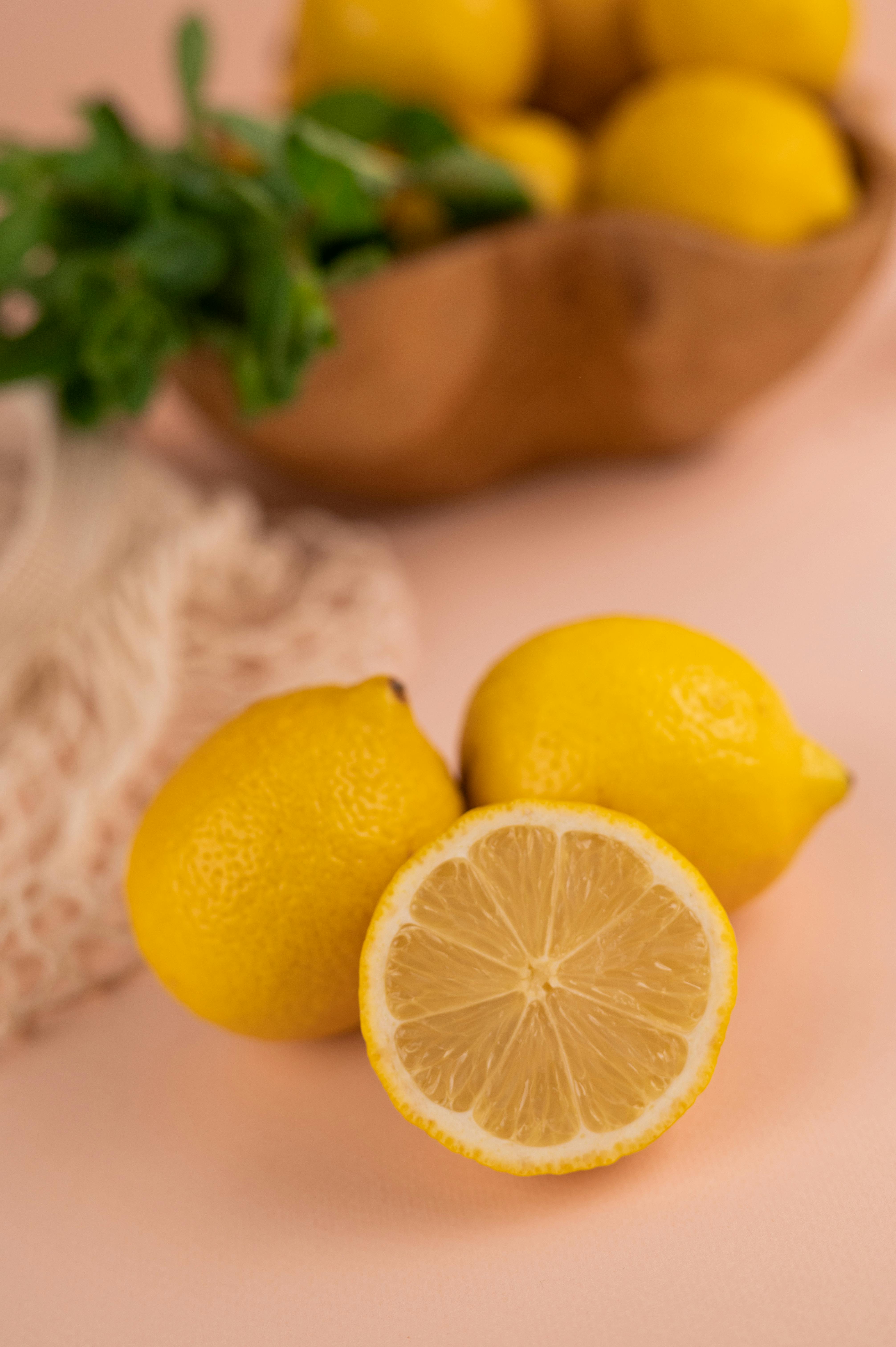 Two Orange and Three Lemons on Gray Surface · Free Stock Photo