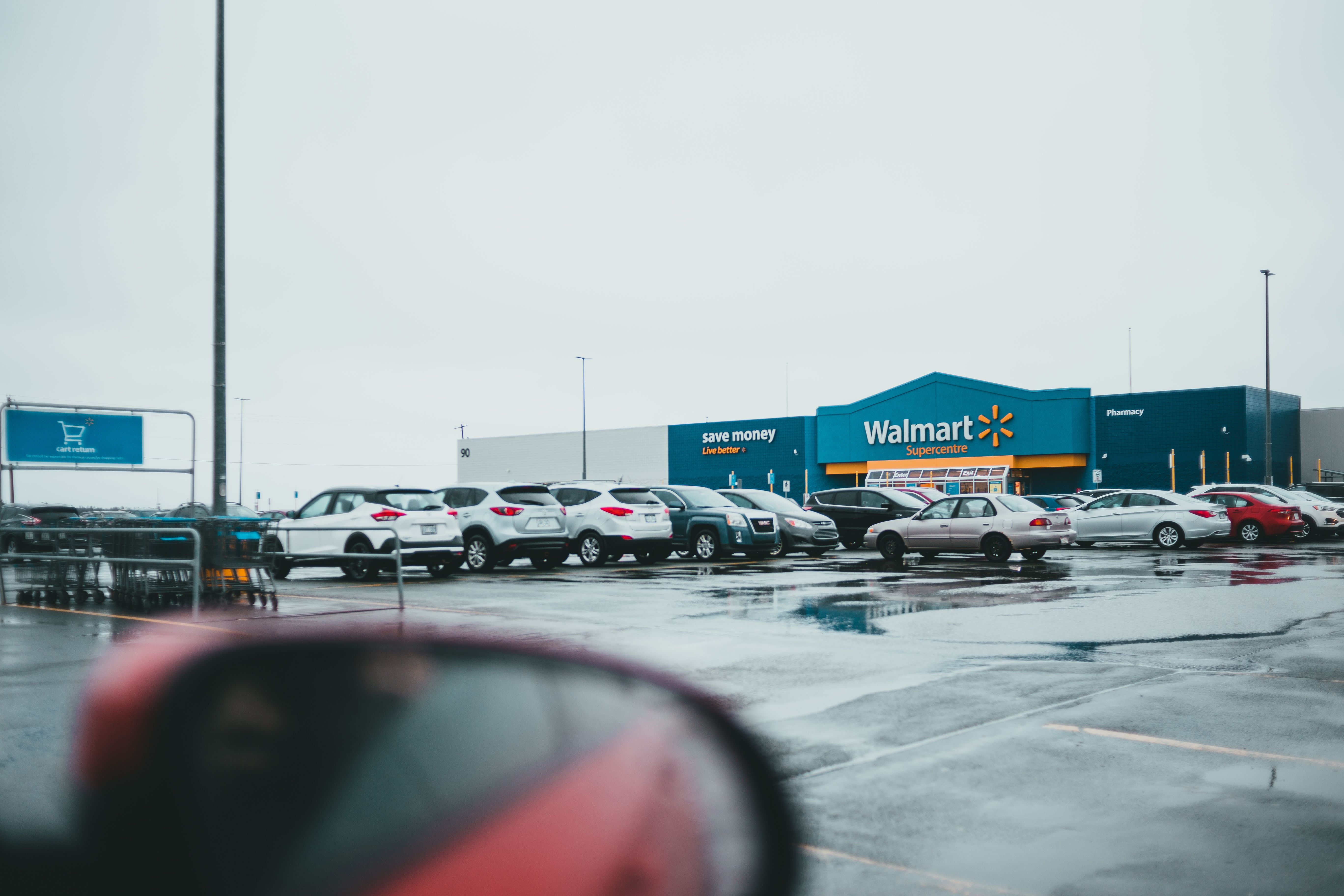 Car parked in parking lot near shop · Free Stock Photo