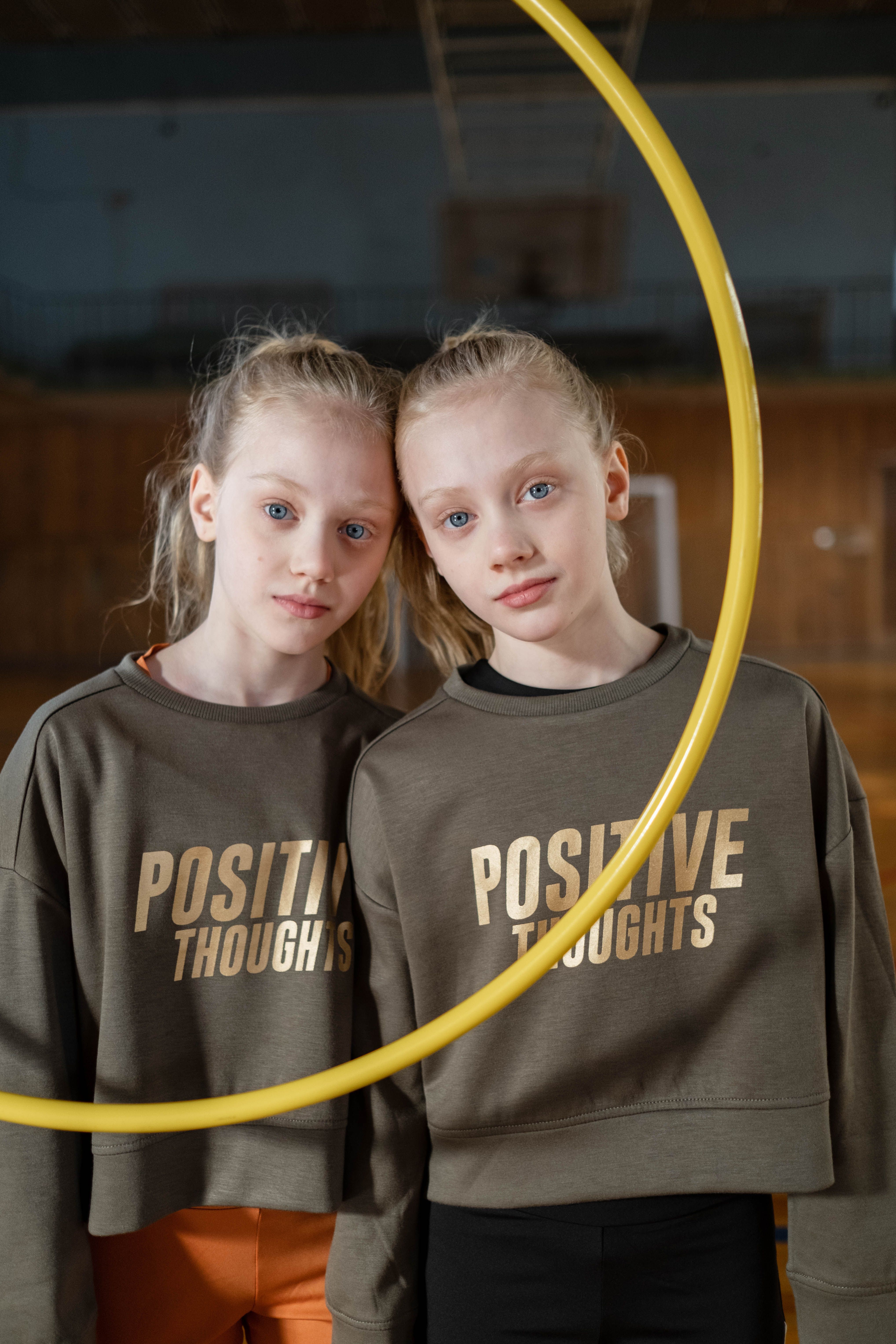 Girl in Orange Sports Wear Doing Hula Hoop · Free Stock Photo