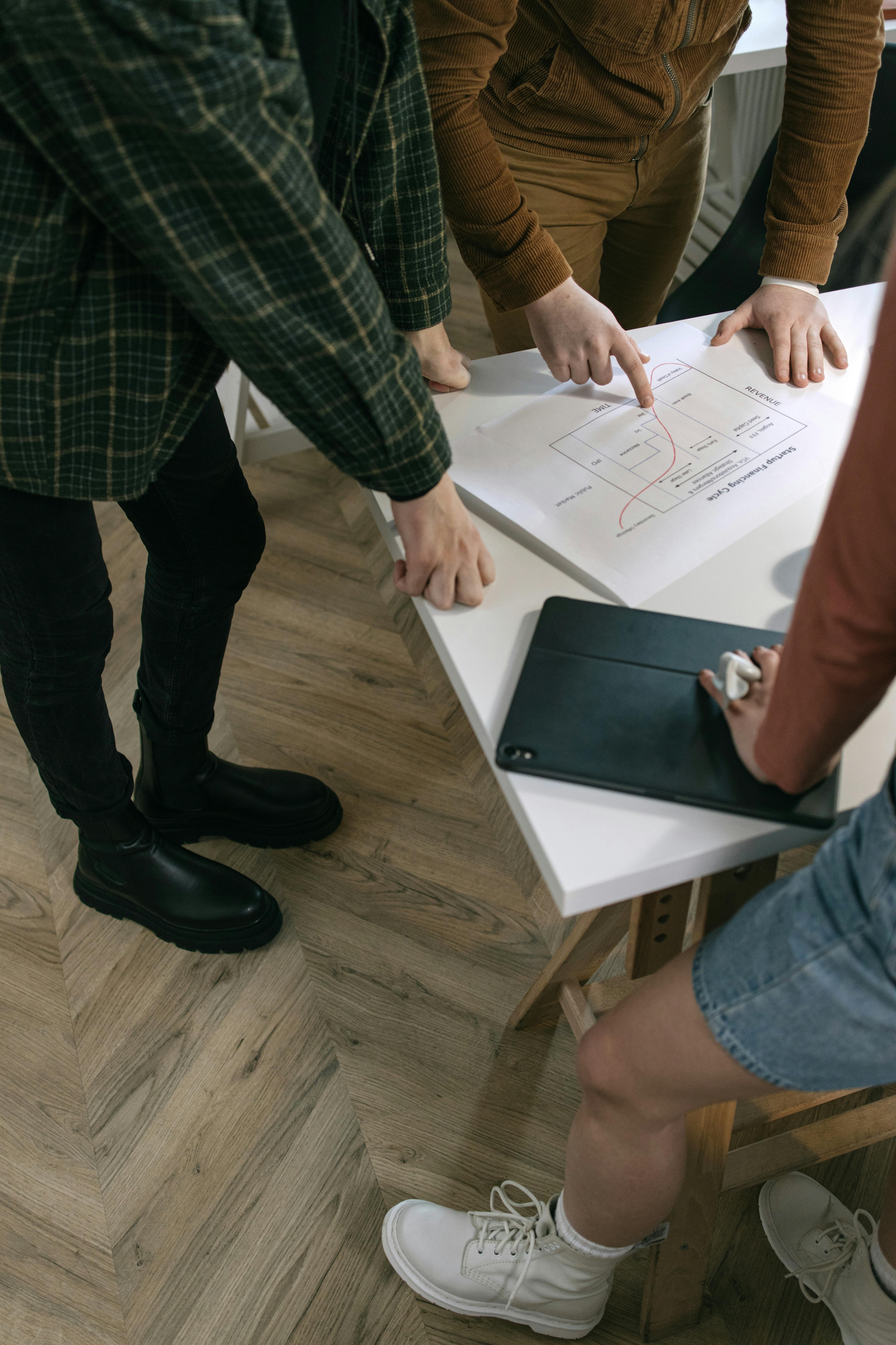 People Standing Beside a Desk · Free Stock Photo