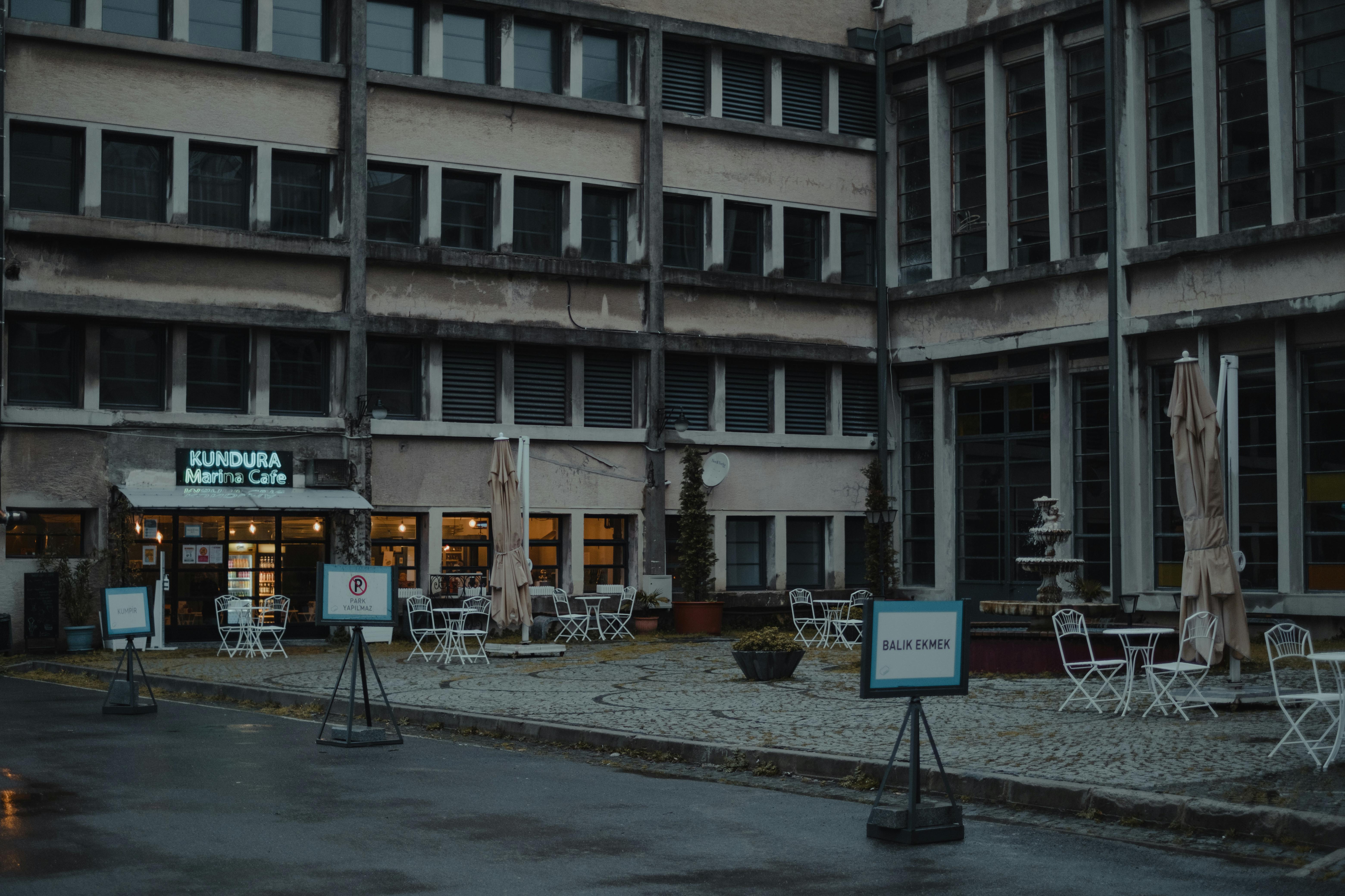 Terrace of cafe near old buildings · Free Stock Photo