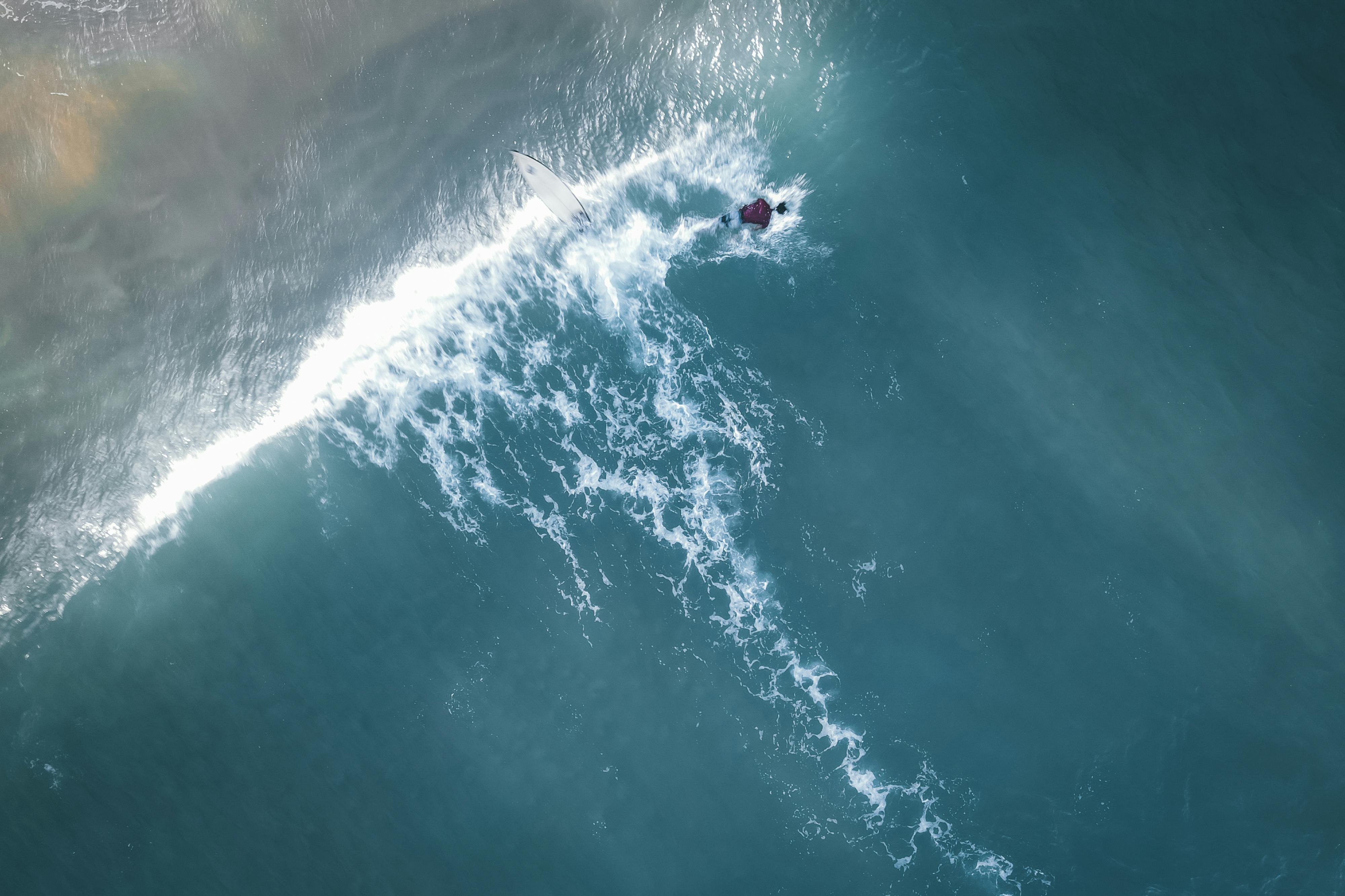 Surfer Falling Off from a Board · Free Stock Photo