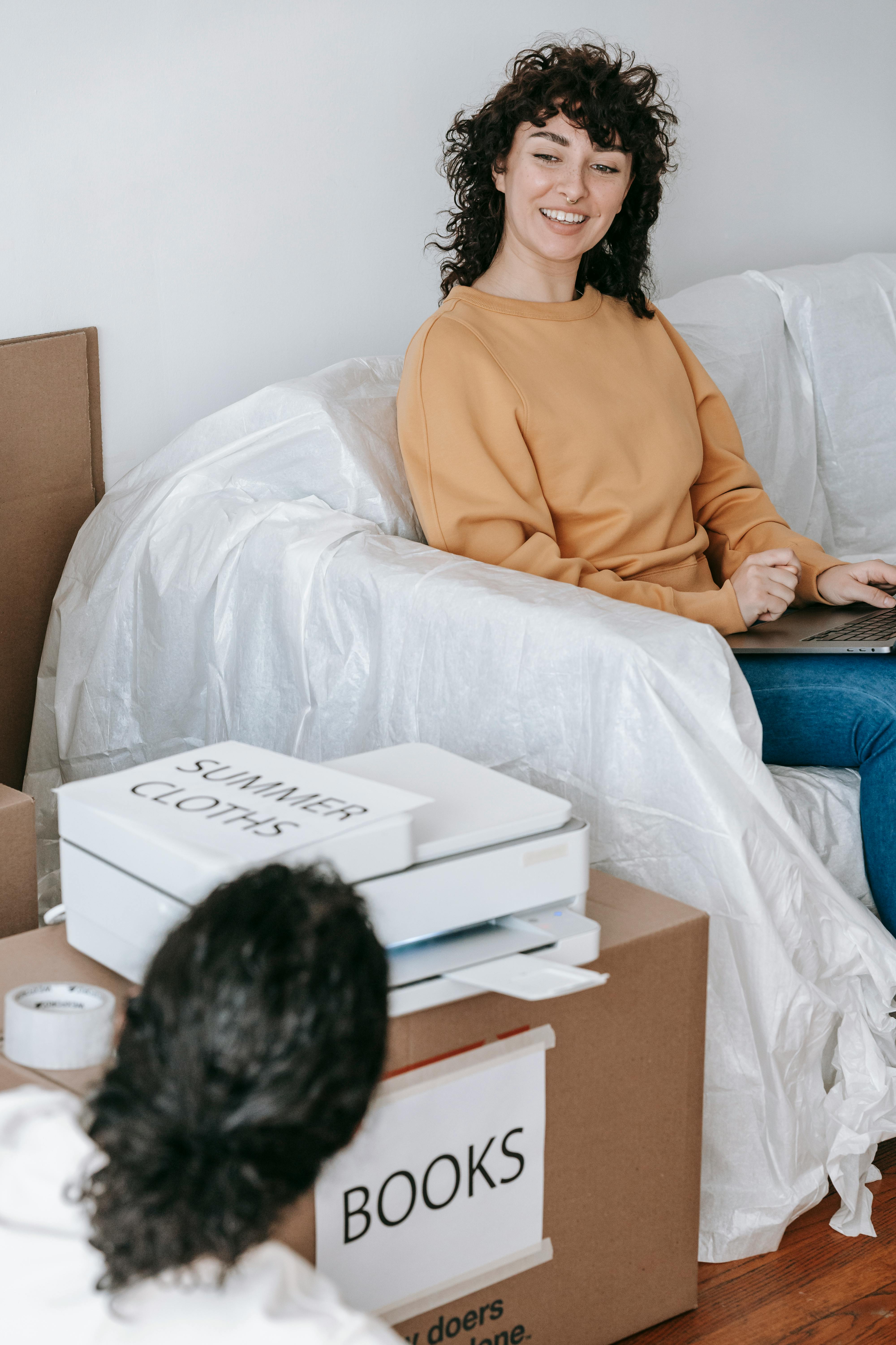 Smiling Man Printing A Label · Free Stock Photo