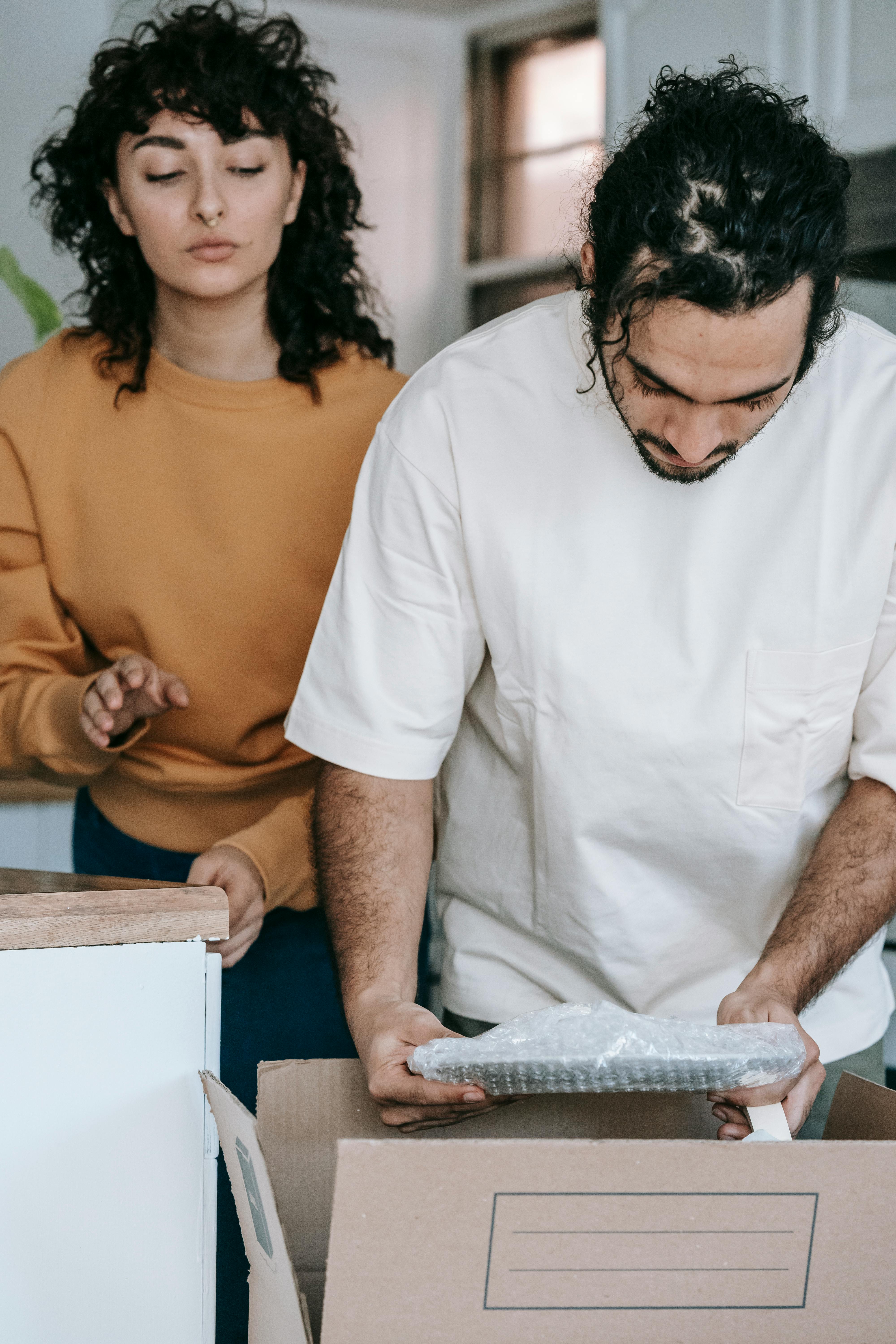 Man Packing Up A Plate To A Box · Free Stock Photo