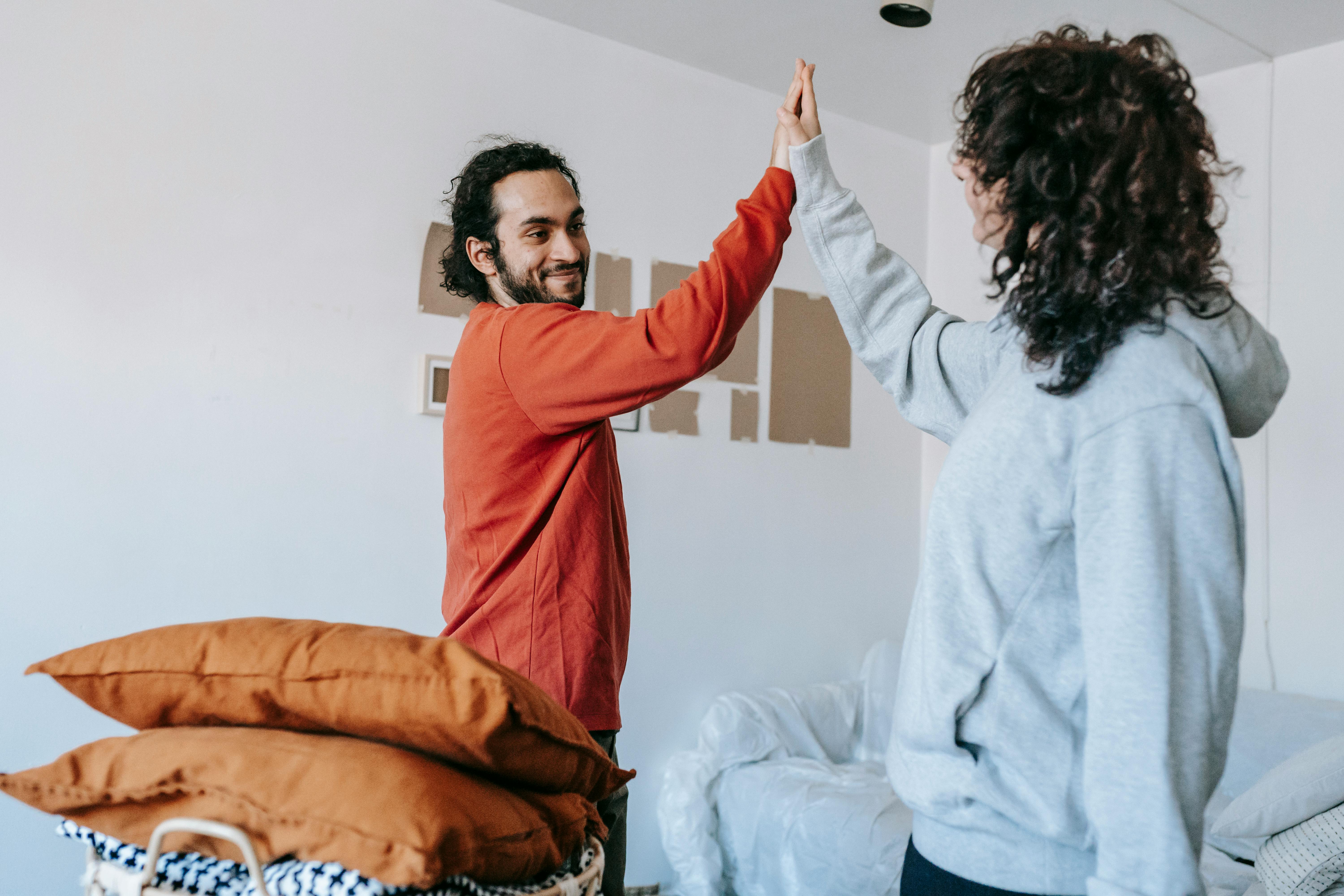 Couple Doing High Five · Free Stock Photo