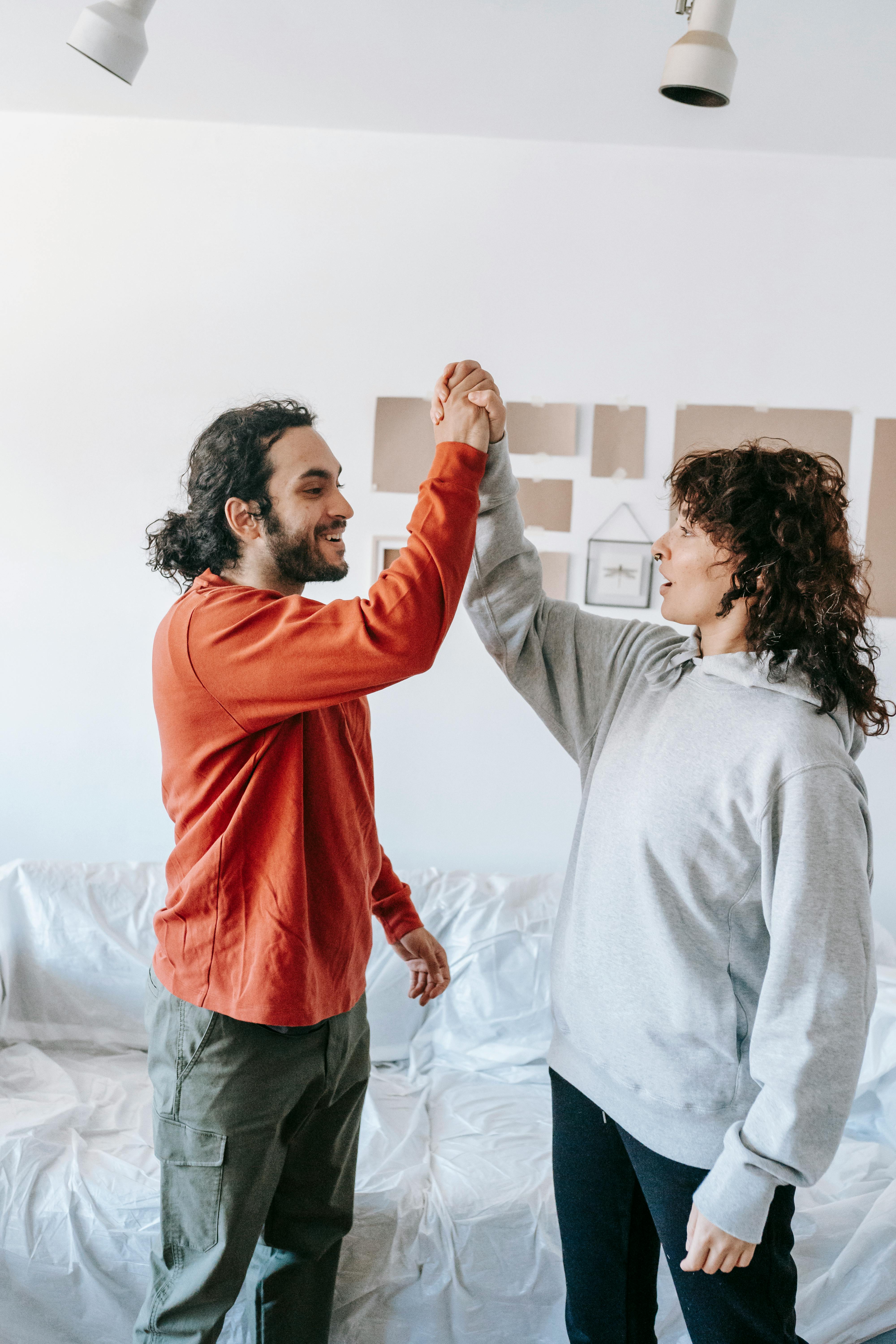 Couple Doing High Five · Free Stock Photo