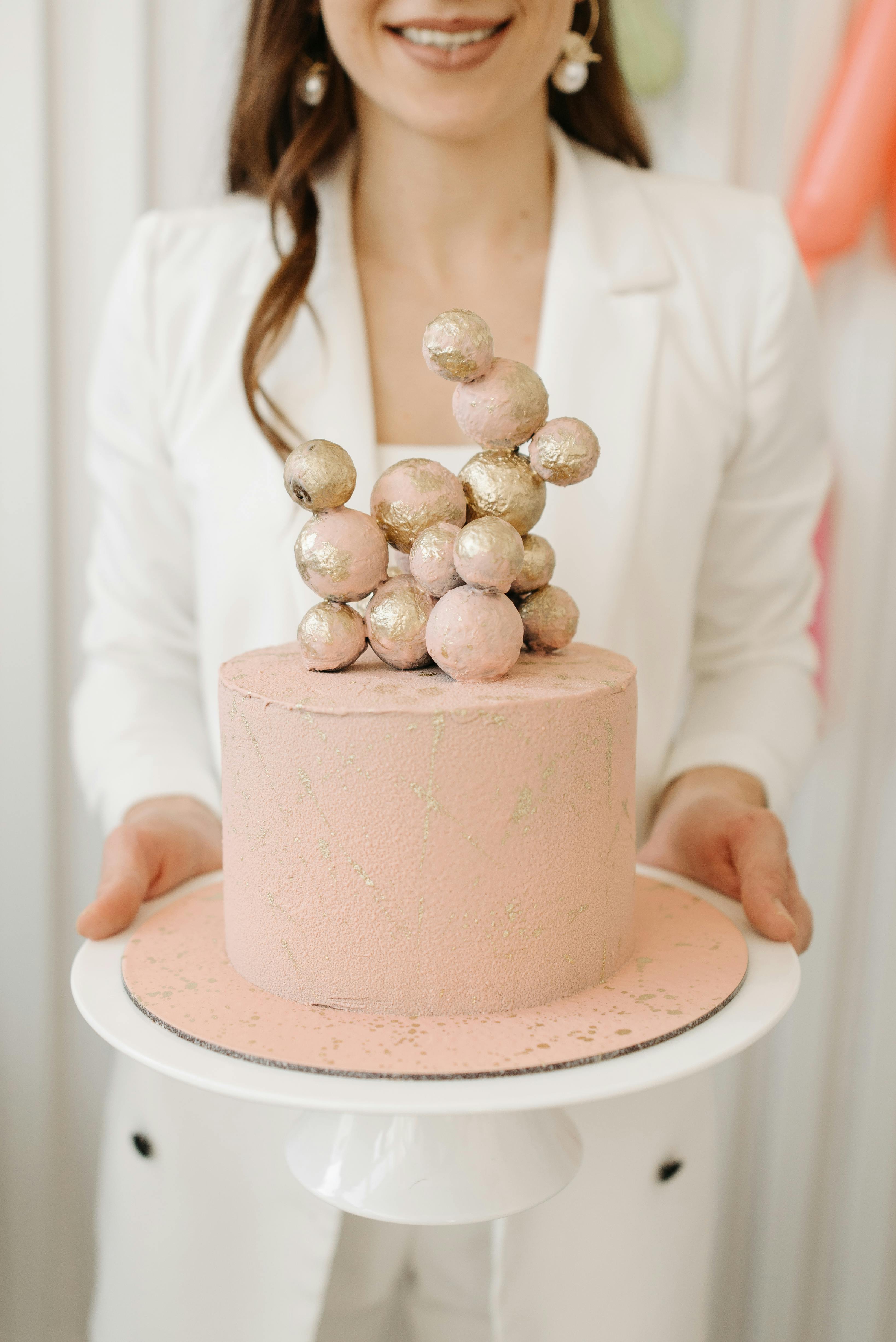 Woman Holding a Cake · Free Stock Photo
