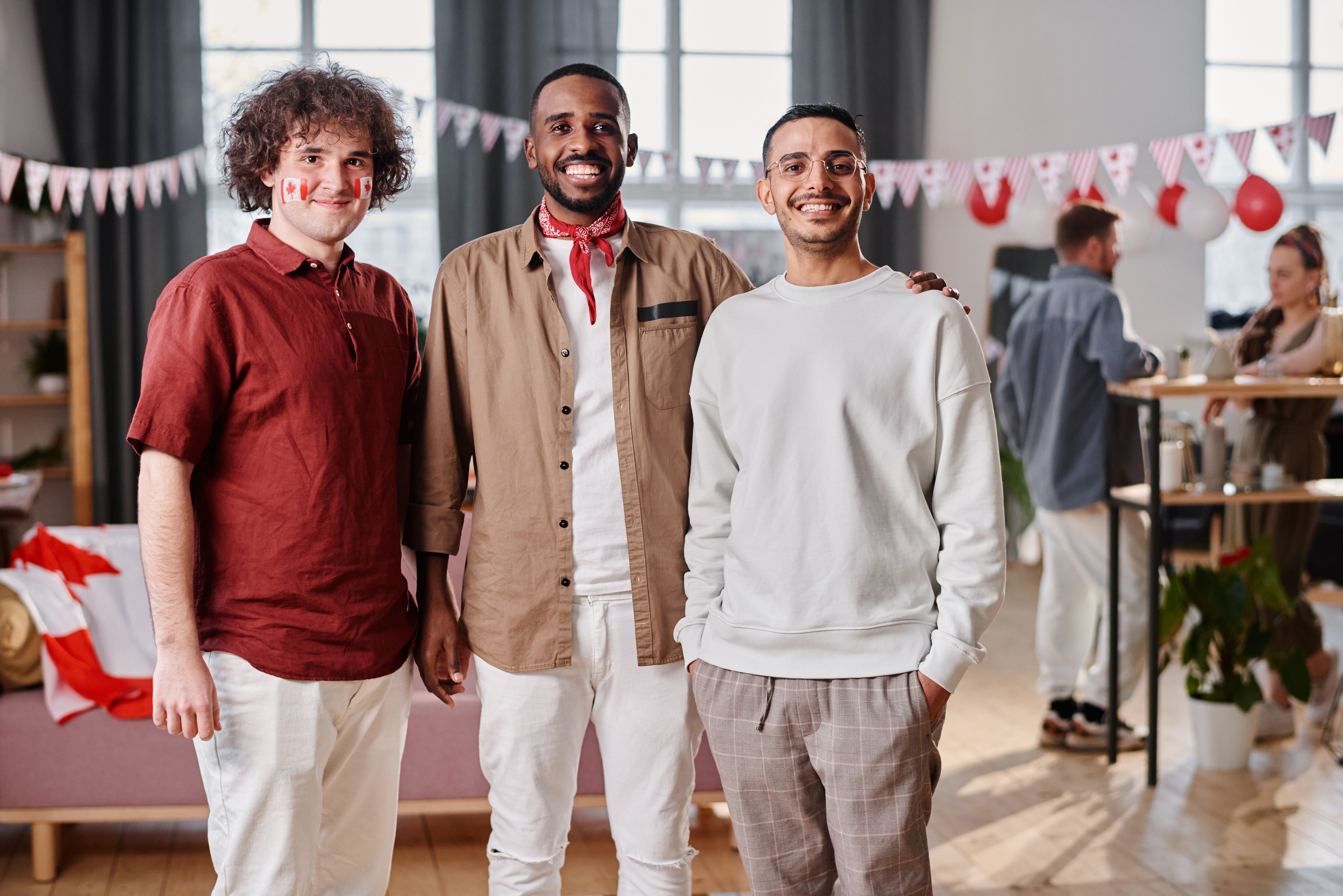Smiling Men Standing Close Together · Free Stock Photo