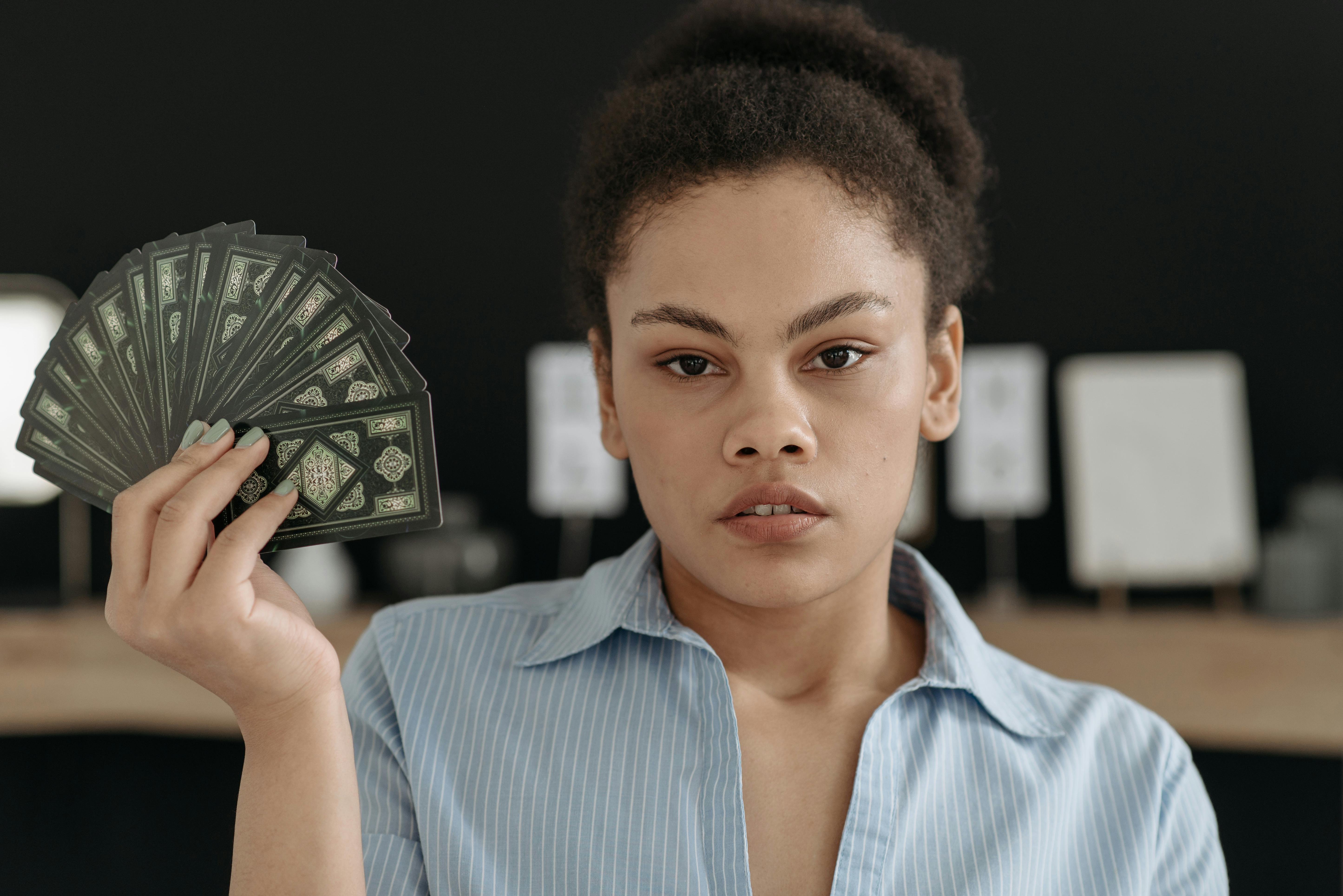 Woman Holding Cards in Close Up Photography · Free Stock Photo