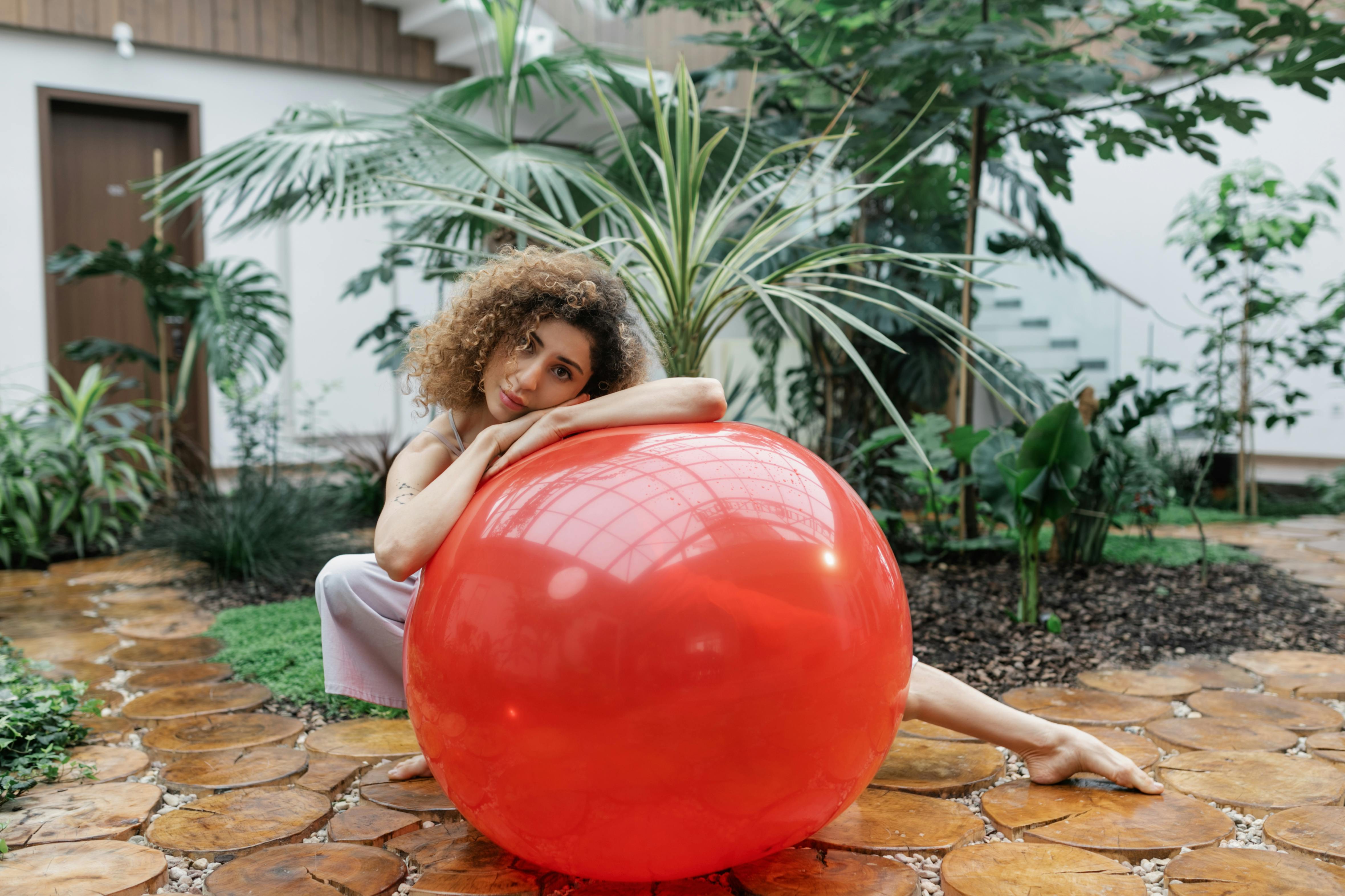 Woman Posing with an Exercise Ball · Free Stock Photo