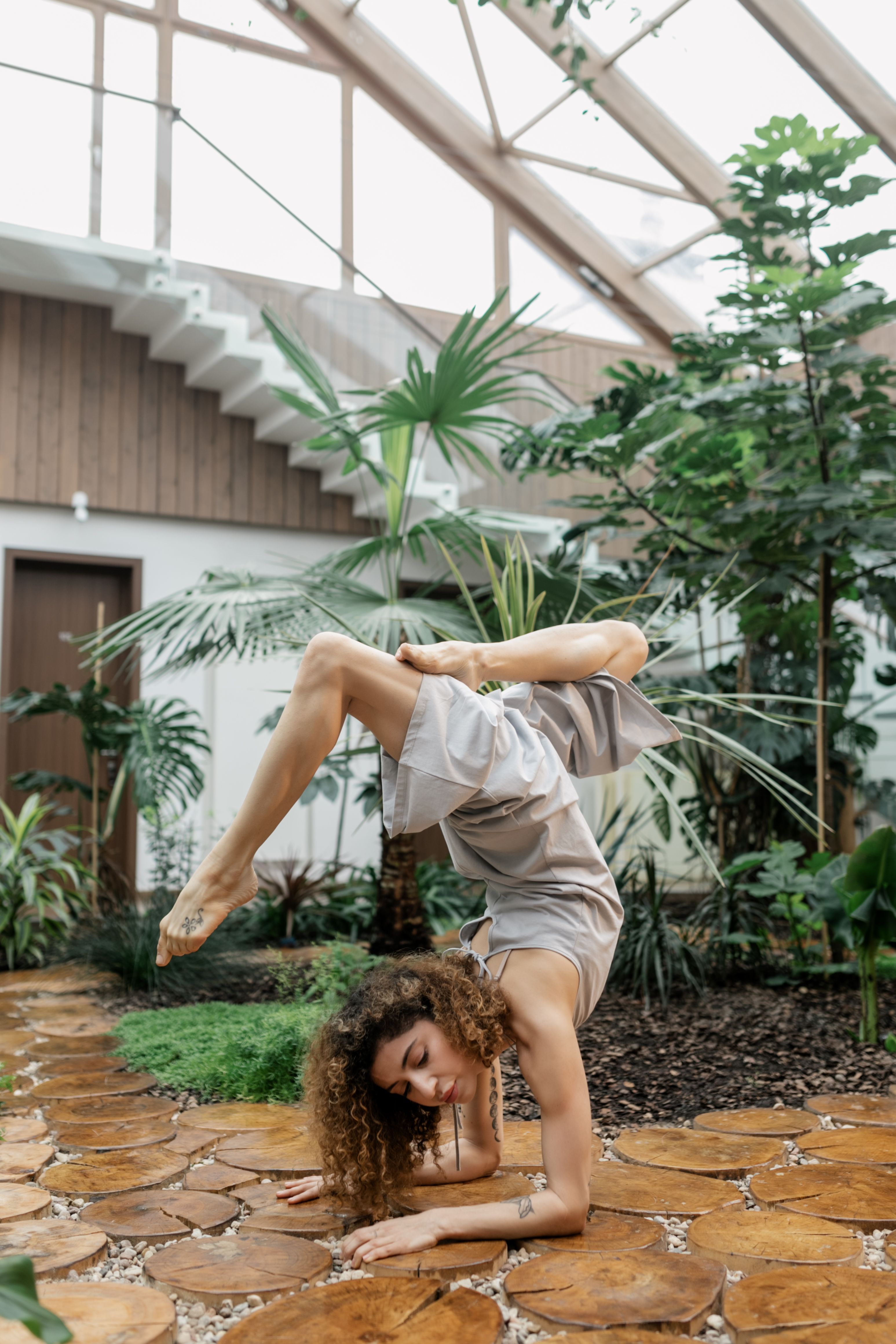 Woman Doing a Hand Stand Pose · Free Stock Photo