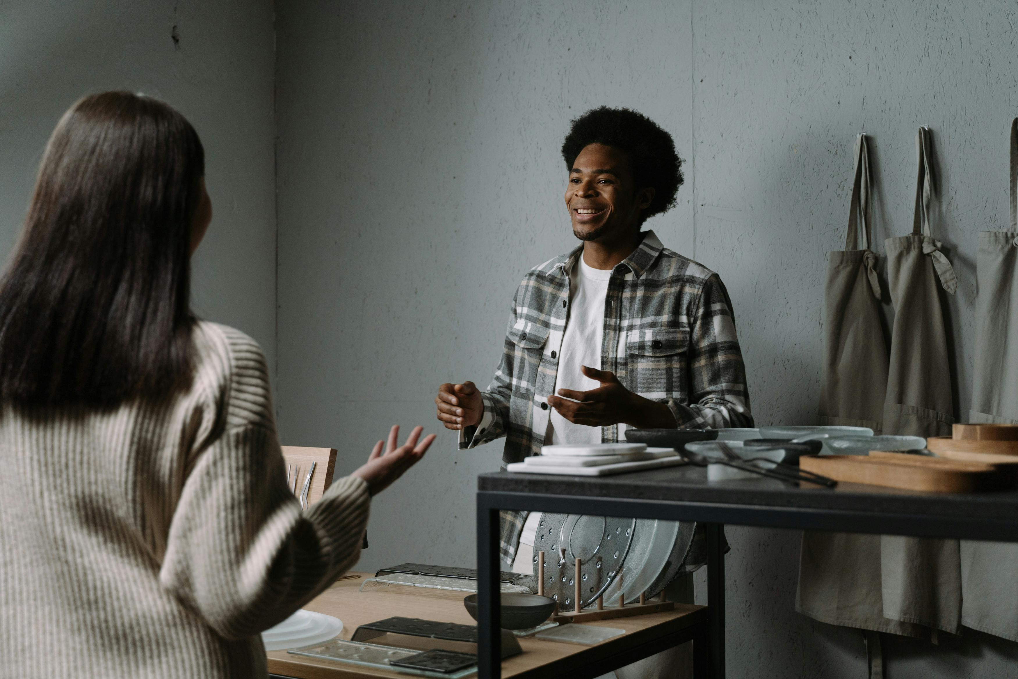 Two People Talking in a Room · Free Stock Photo