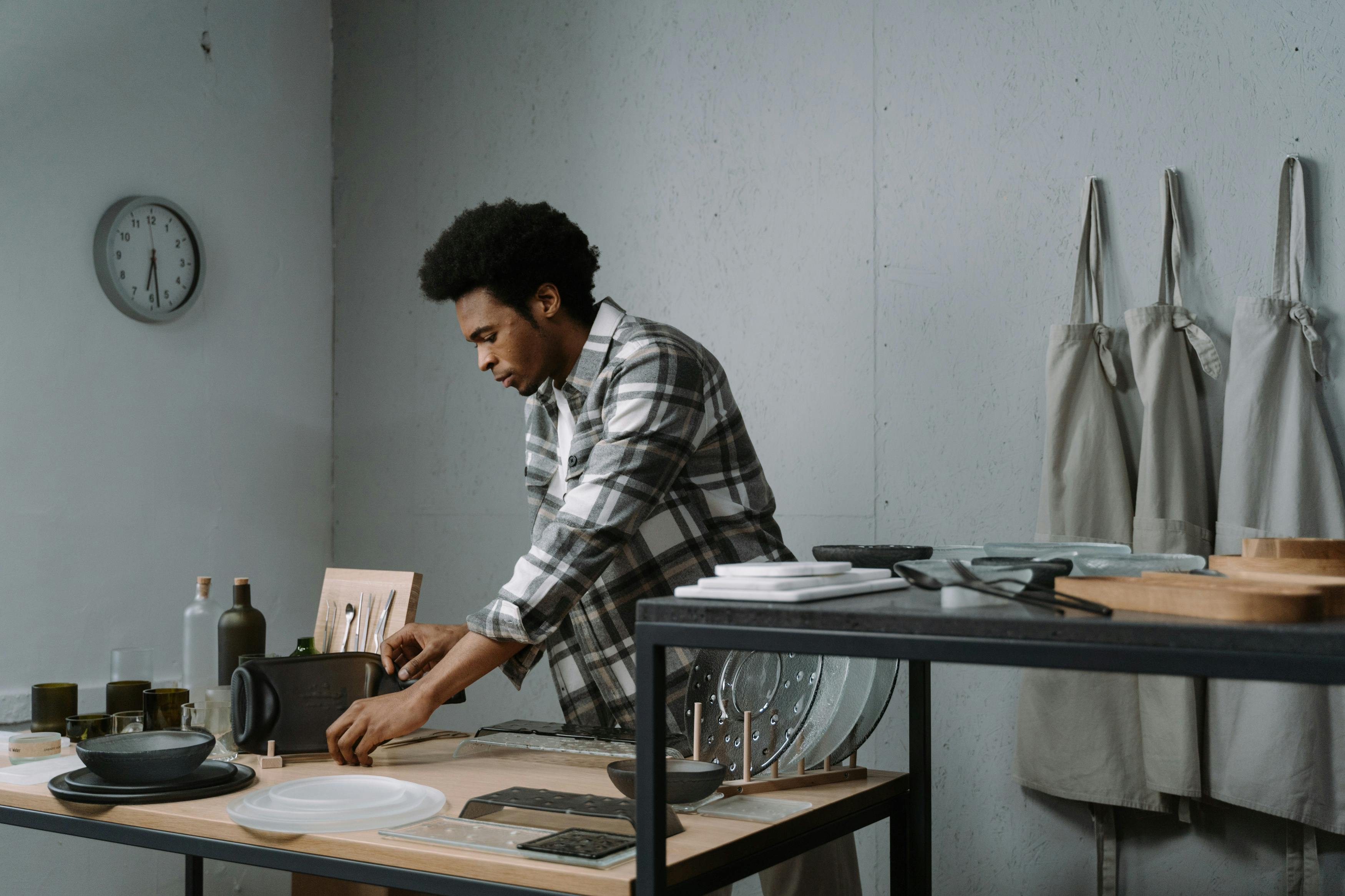 Photo of a Man Selling Crockery · Free Stock Photo