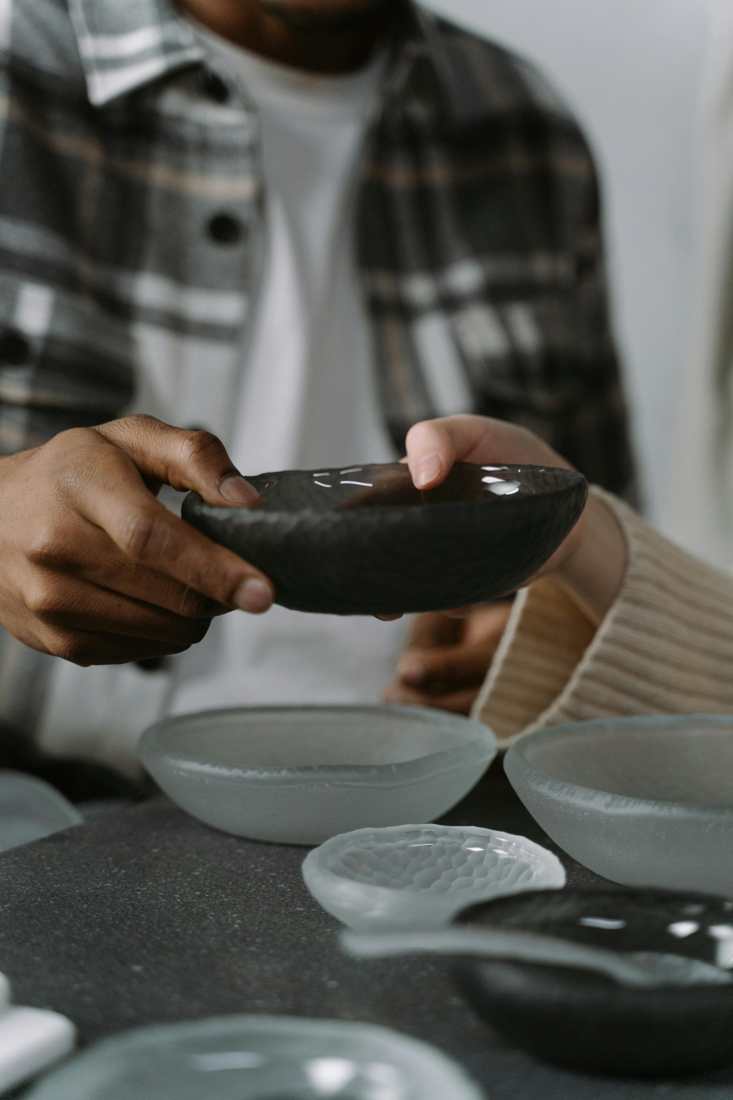 Two People Holding a Glass Bowl · Free Stock Photo