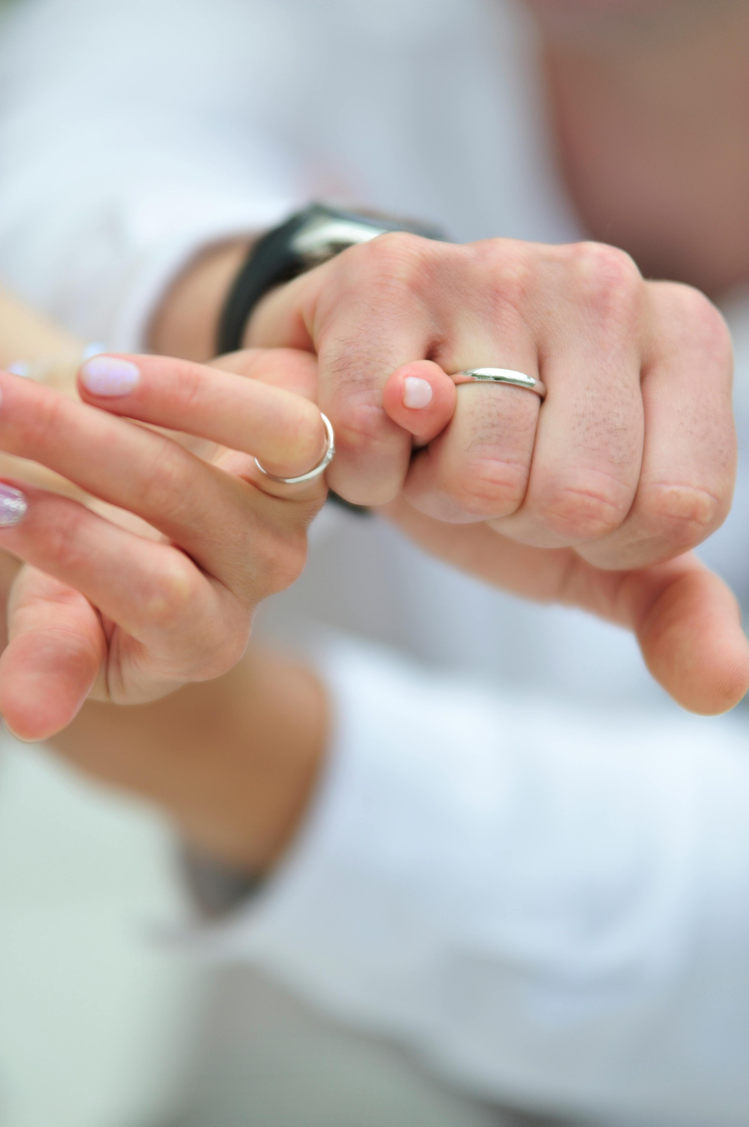 A Man Holding the Woman's Pinkie Finger · Free Stock Photo