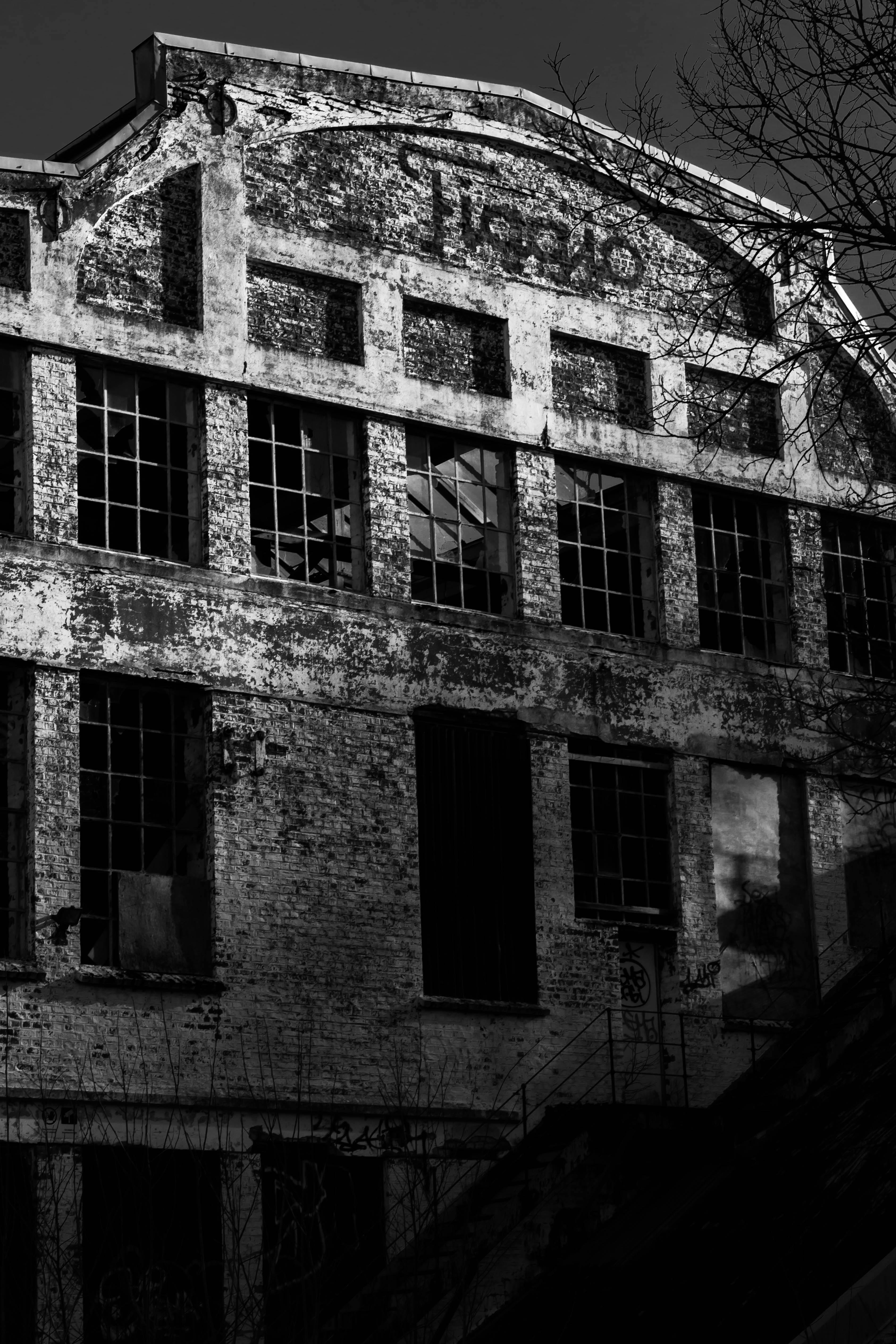 A Grayscale of an Old Brick Building · Free Stock Photo