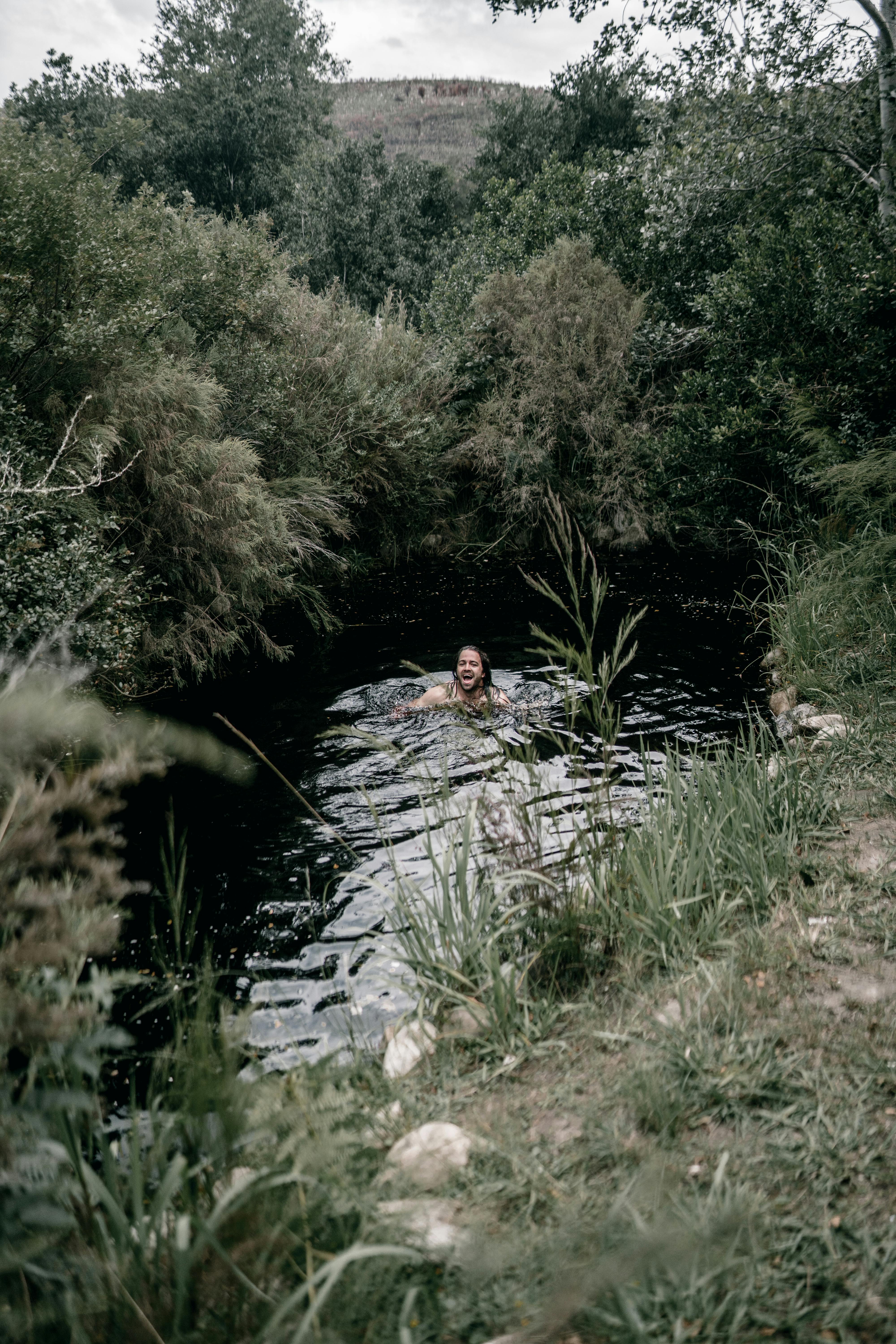 Man Swimming in a River · Free Stock Photo