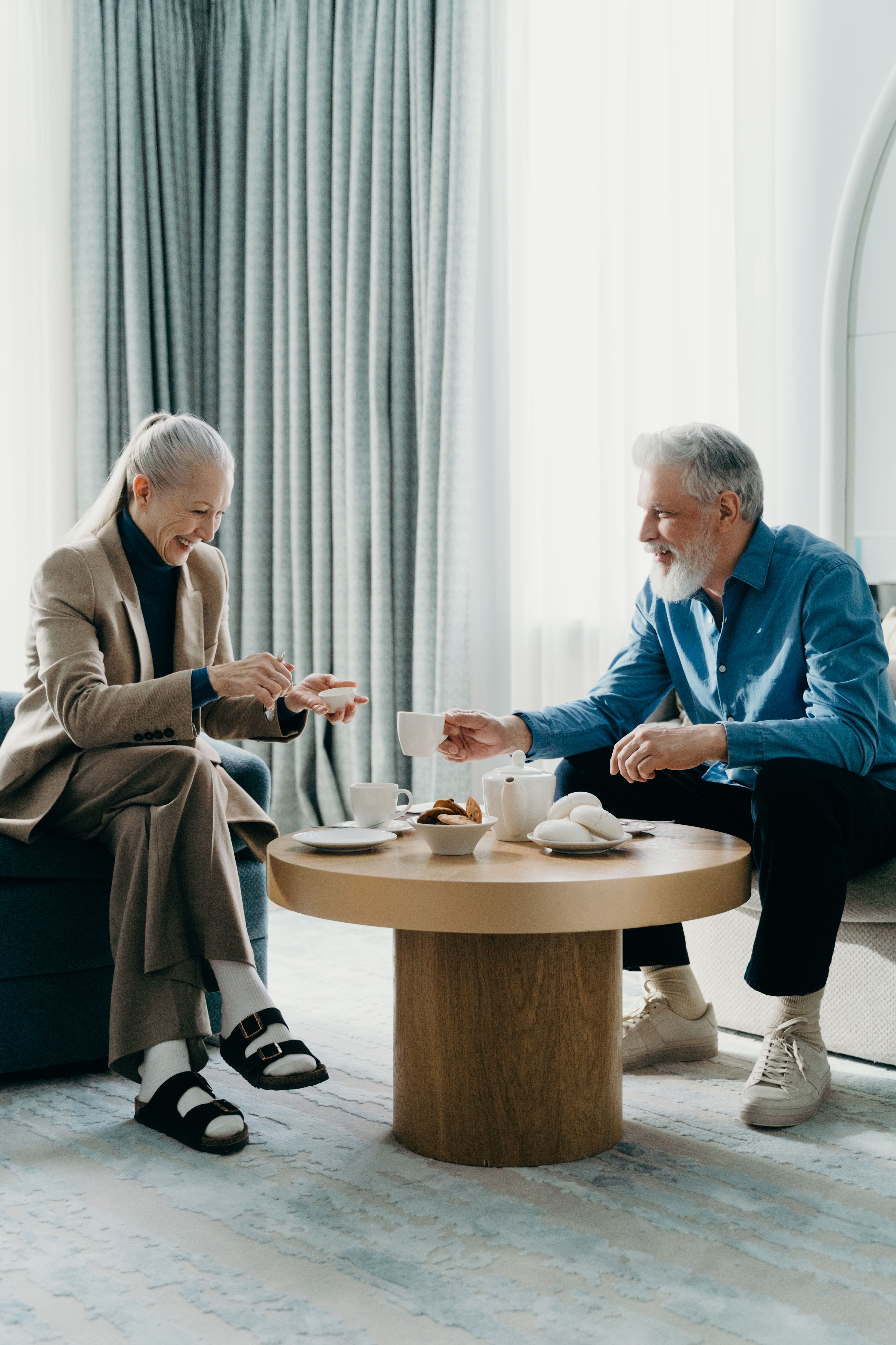 Relaxed Couple sitting on Chairs · Free Stock Photo