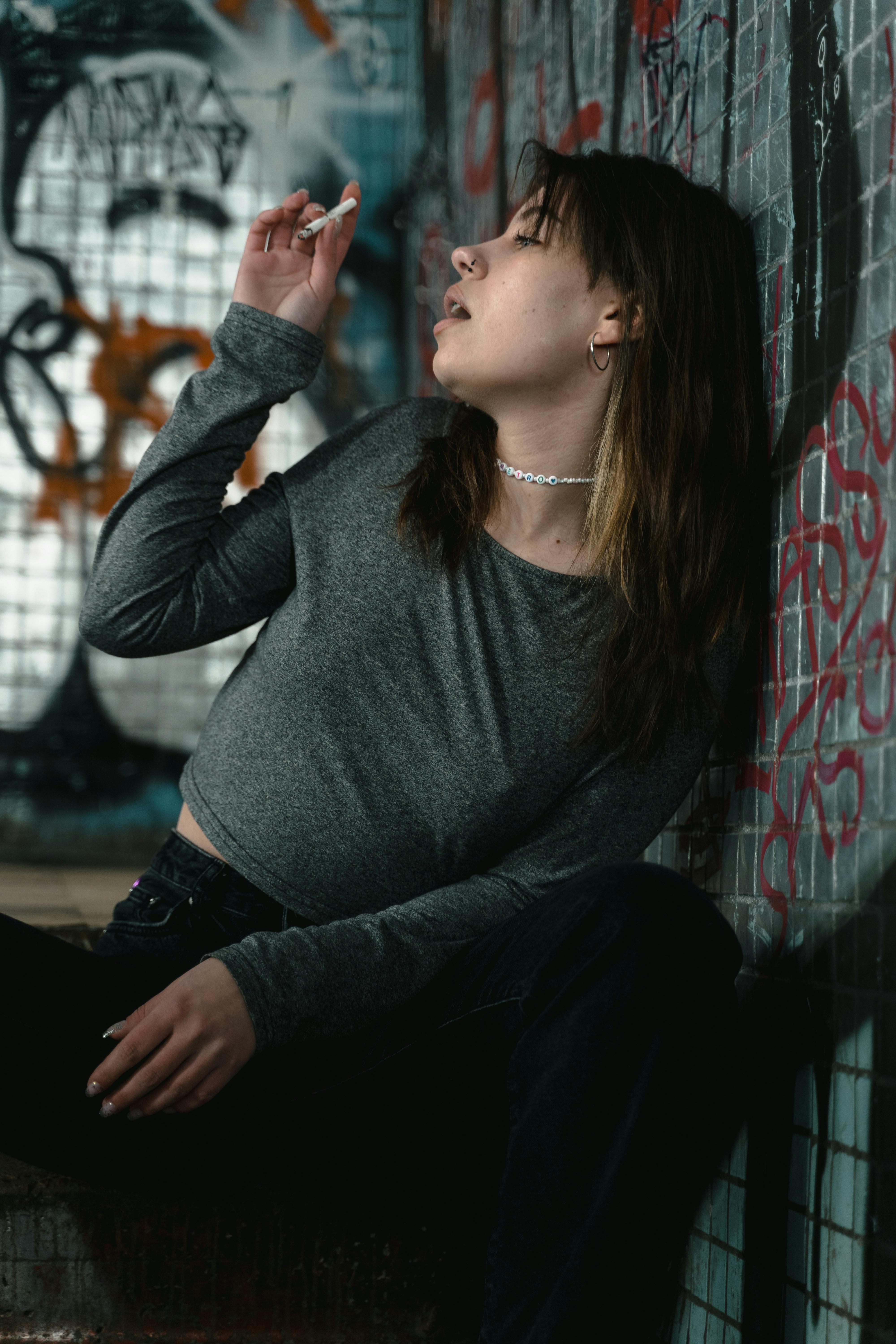 Photograph of a Woman Smoking · Free Stock Photo