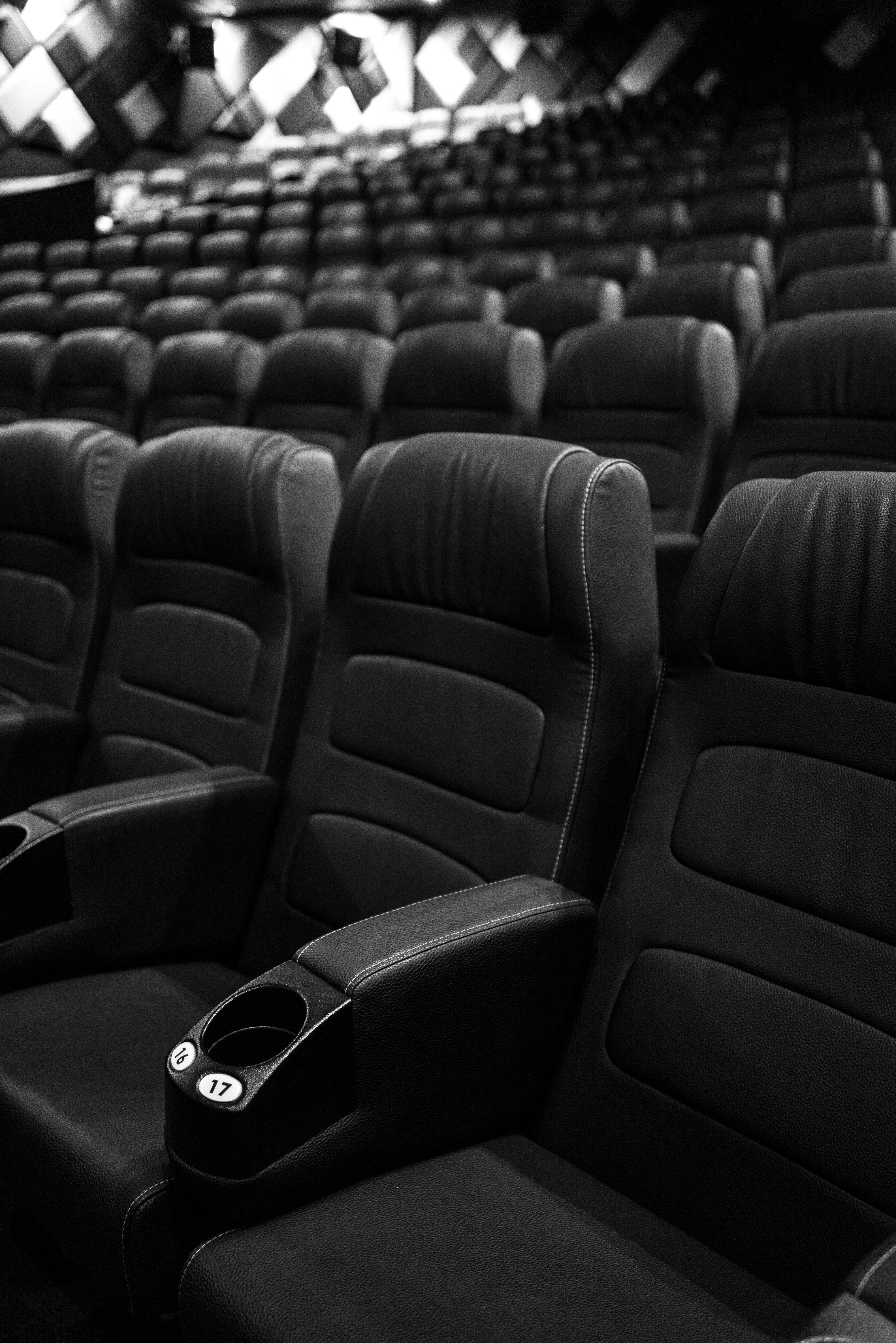 Grayscale Photo of Empty Seats · Free Stock Photo
