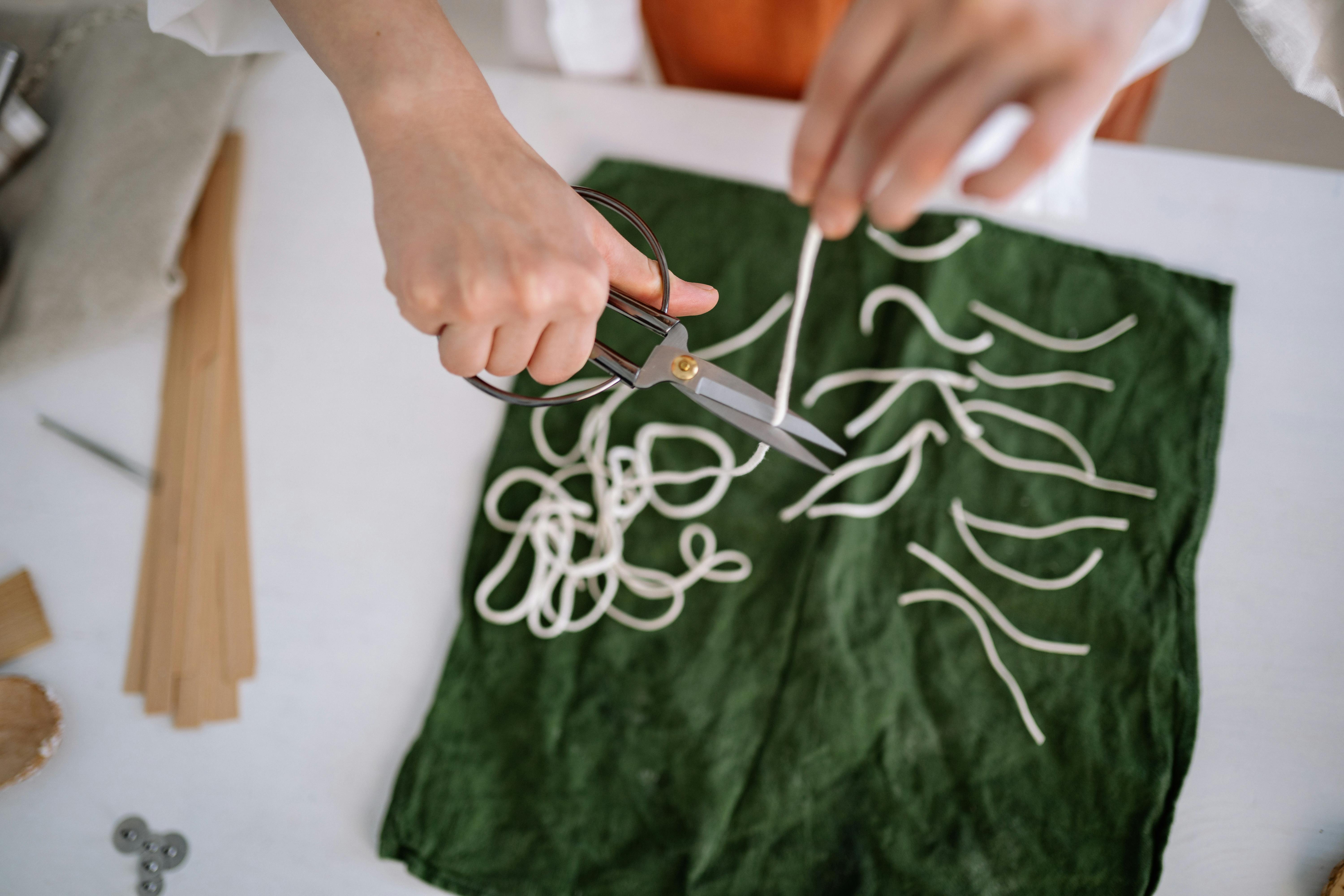 Person Cutting a String · Free Stock Photo