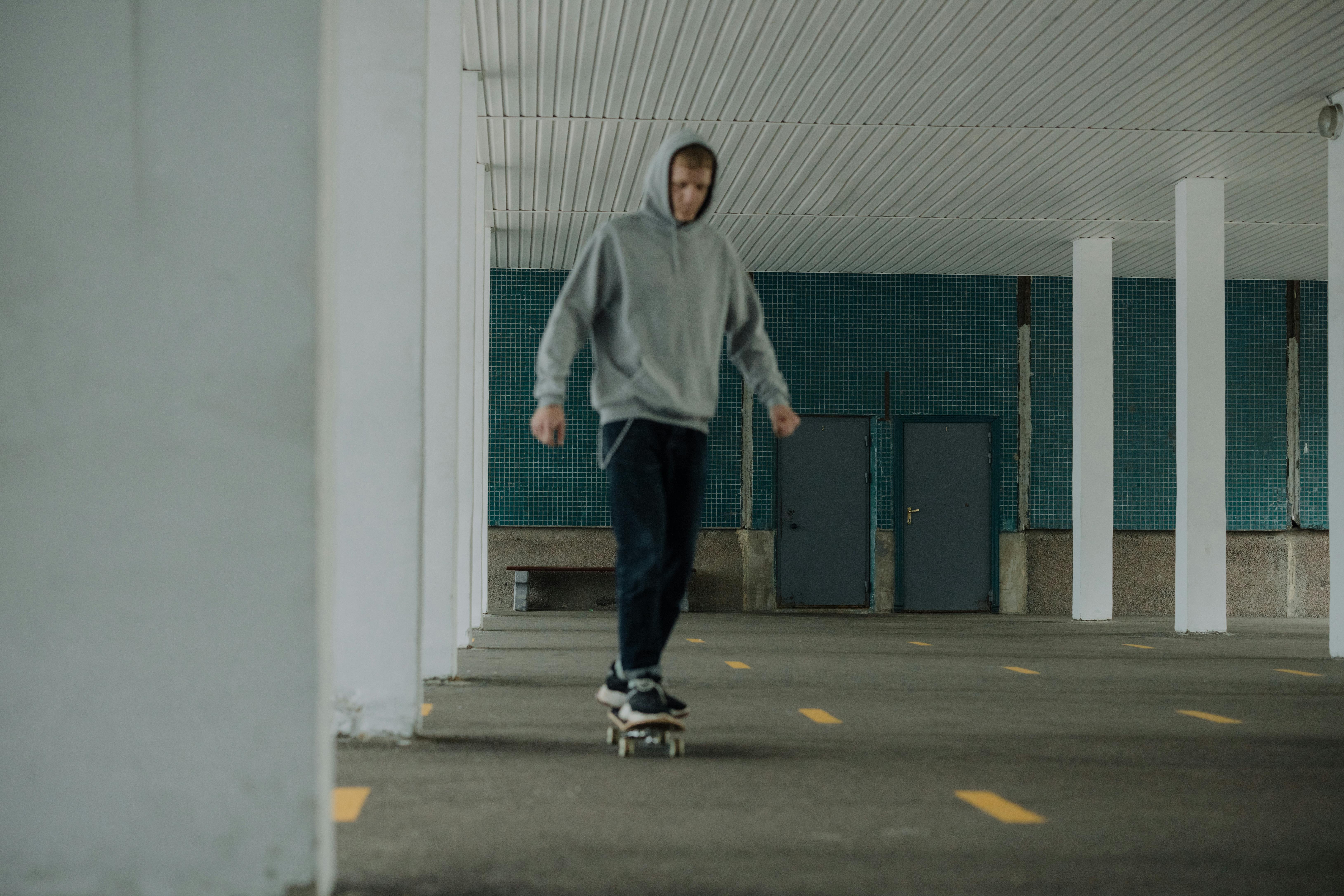 Man Riding Skateboard on Road · Free Stock Photo