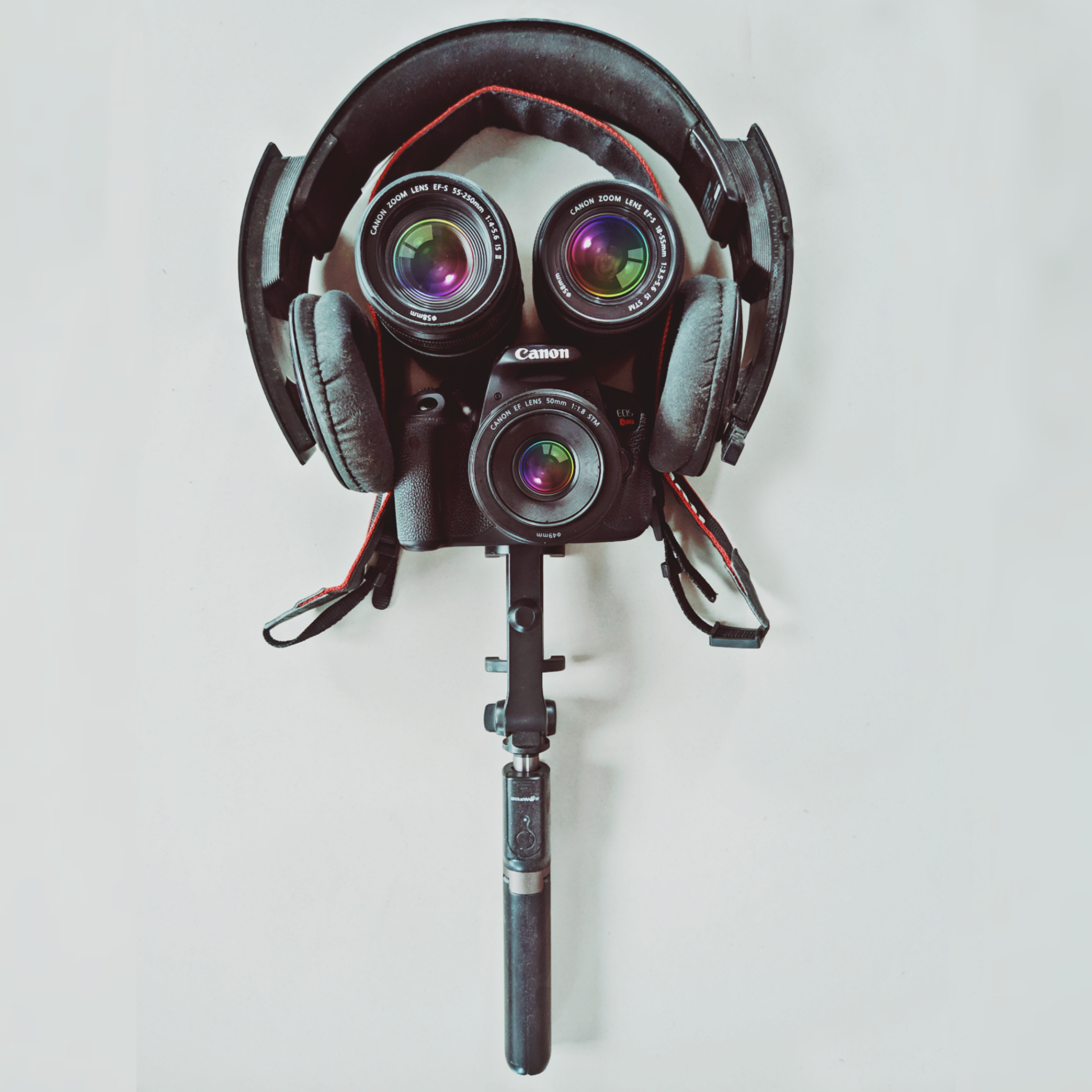 Close-Up Shot of Camera Equipment on a White Surface · Free Stock Photo