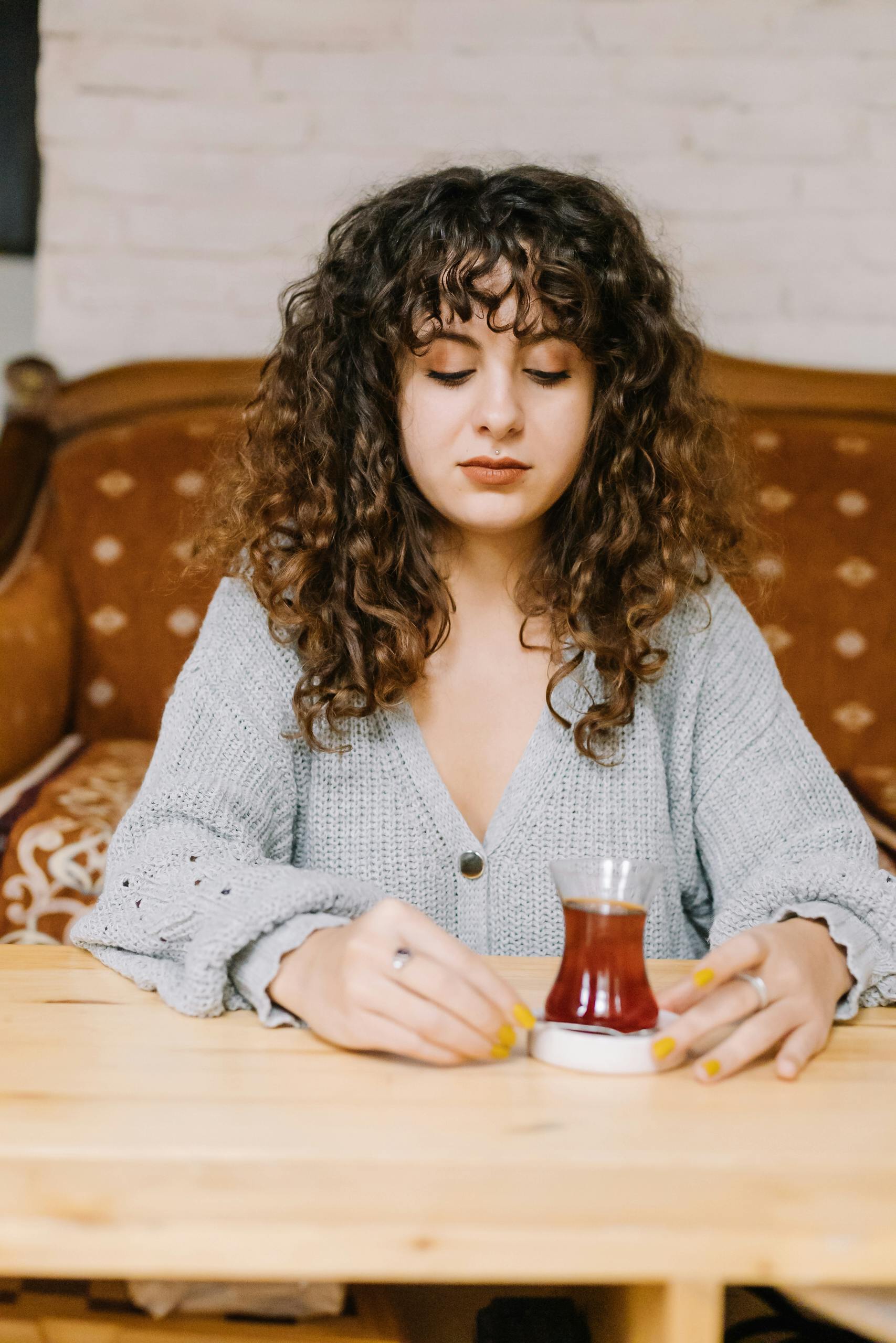 Photo of a Woman Drinking Herbal Tea from a Glass · Free Stock Photo
