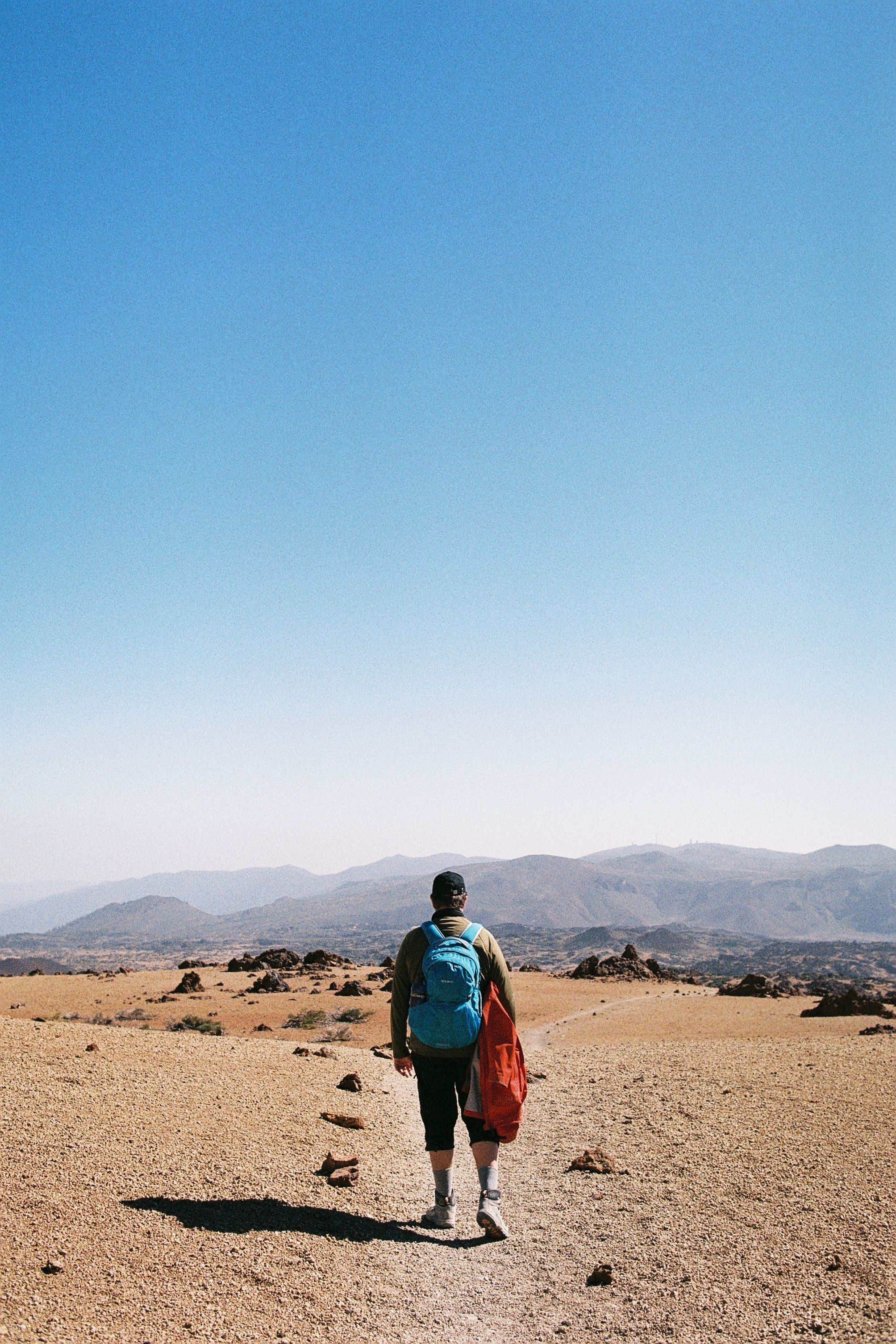 Backpacker Walking in the Desert · Free Stock Photo
