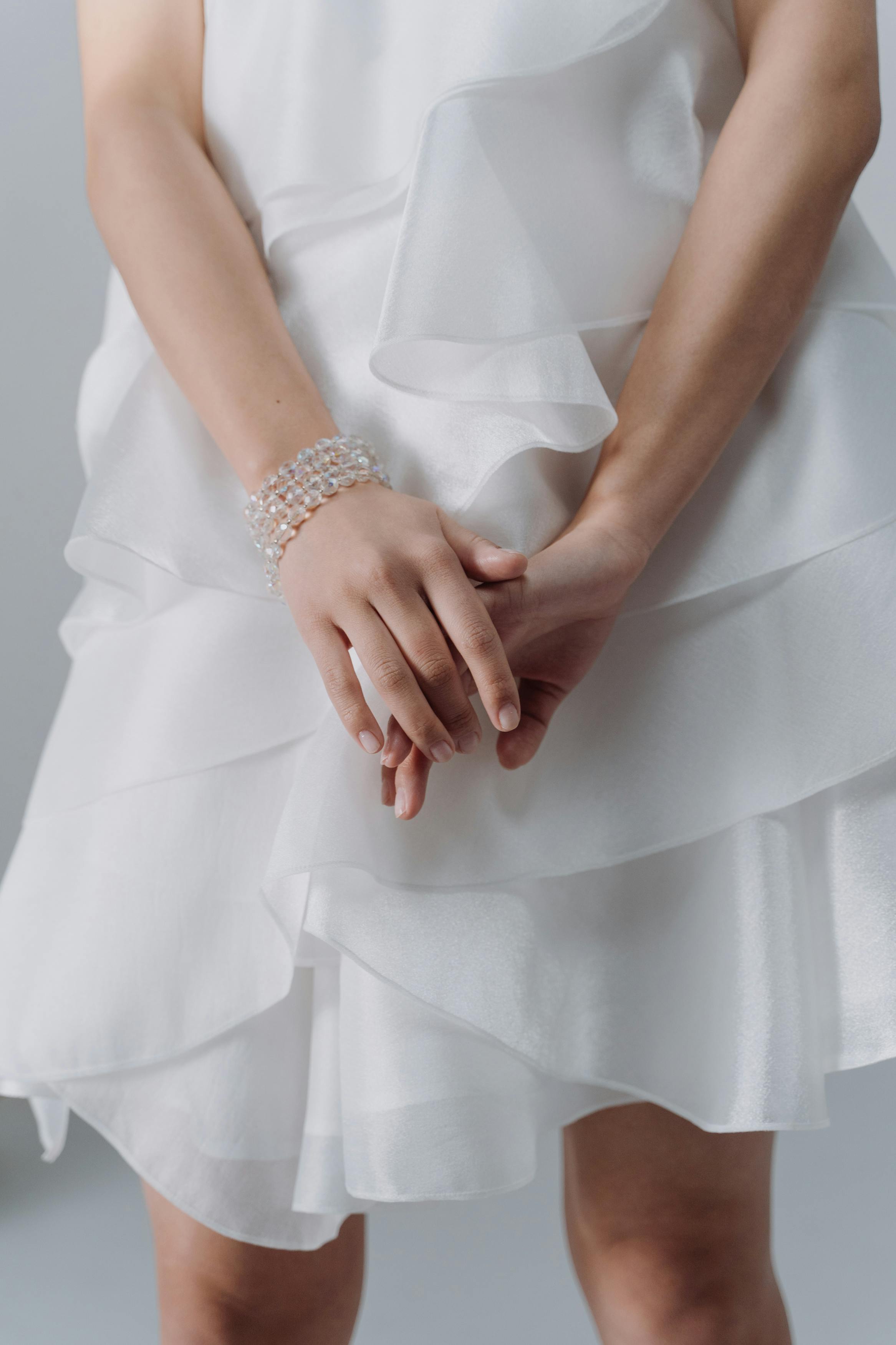 Elegant Woman with Bracelet on Hand · Free Stock Photo