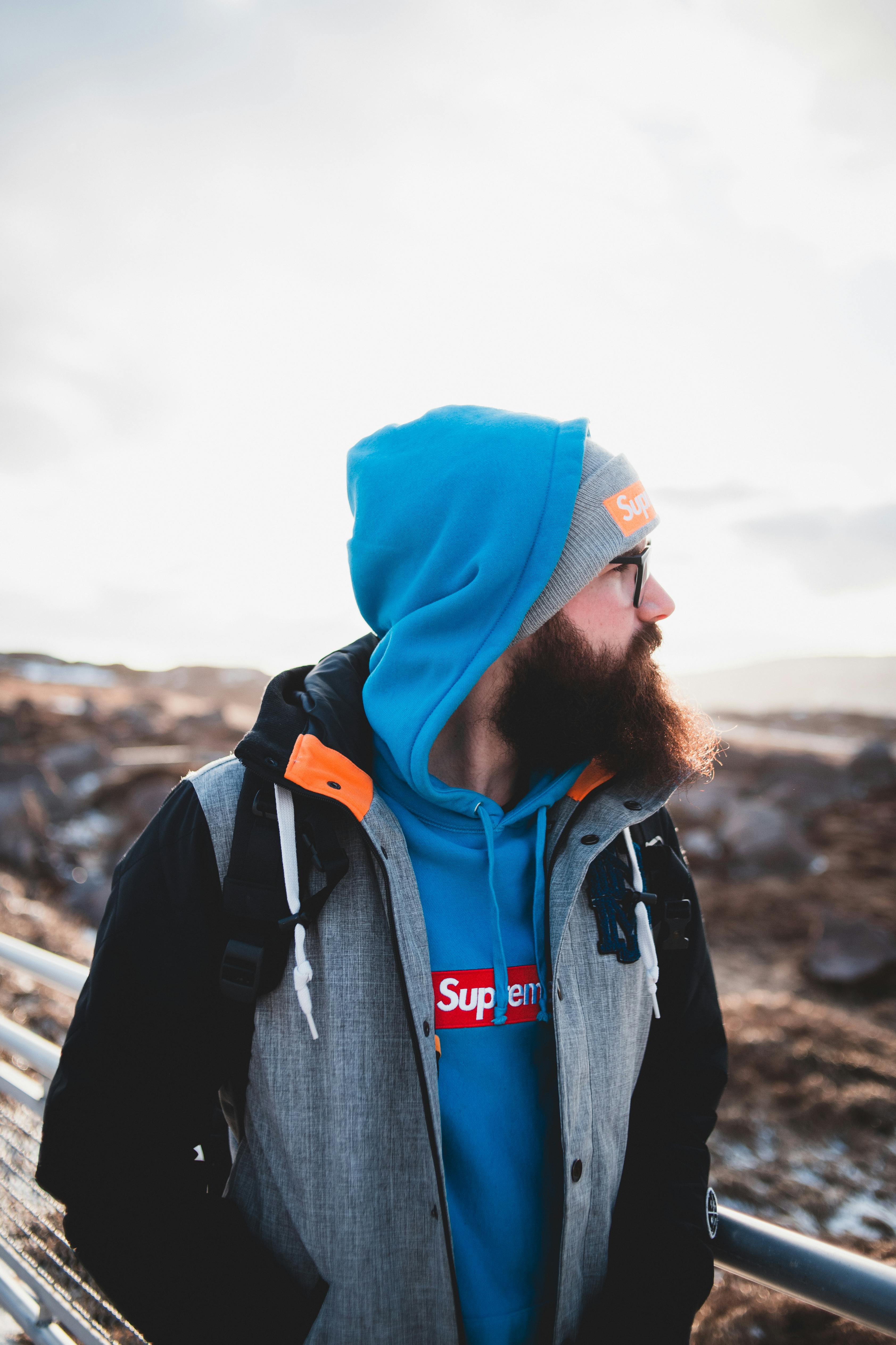 Serious black man using vintage photo camera in nature · Free Stock Photo