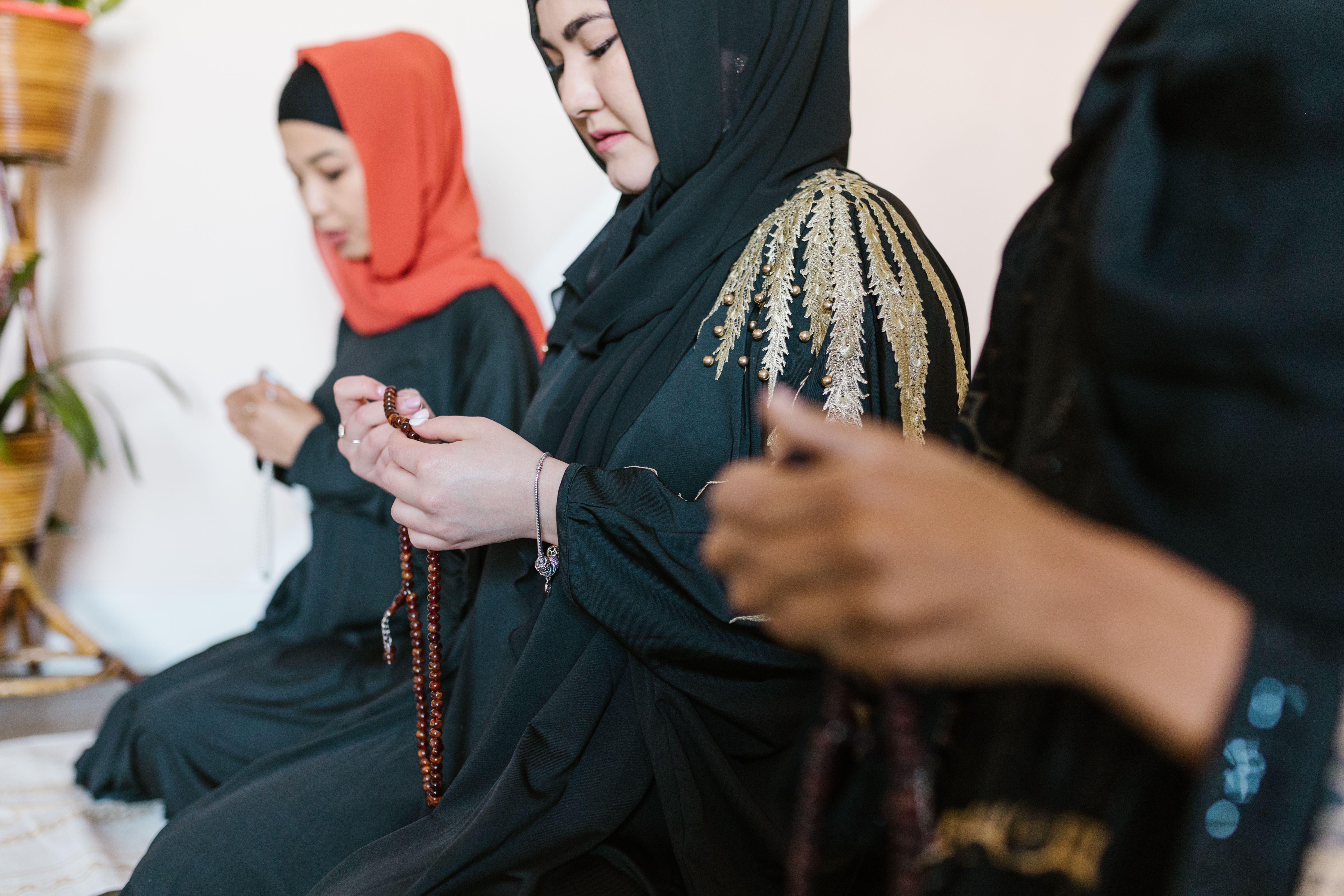 Women in Hijab Sitting on Floor · Free Stock Photo