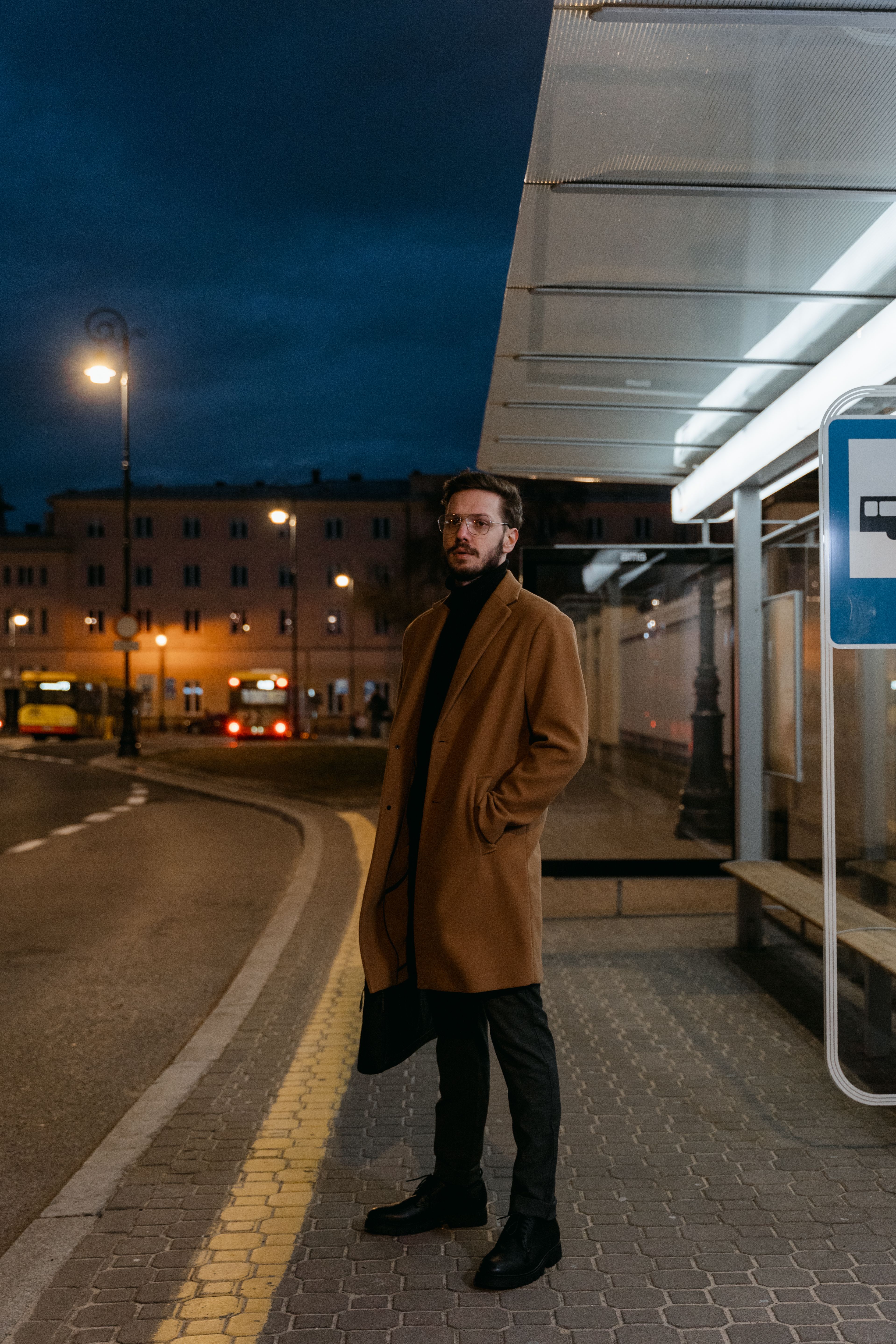 A Man Waiting at the Bus Stop · Free Stock Photo