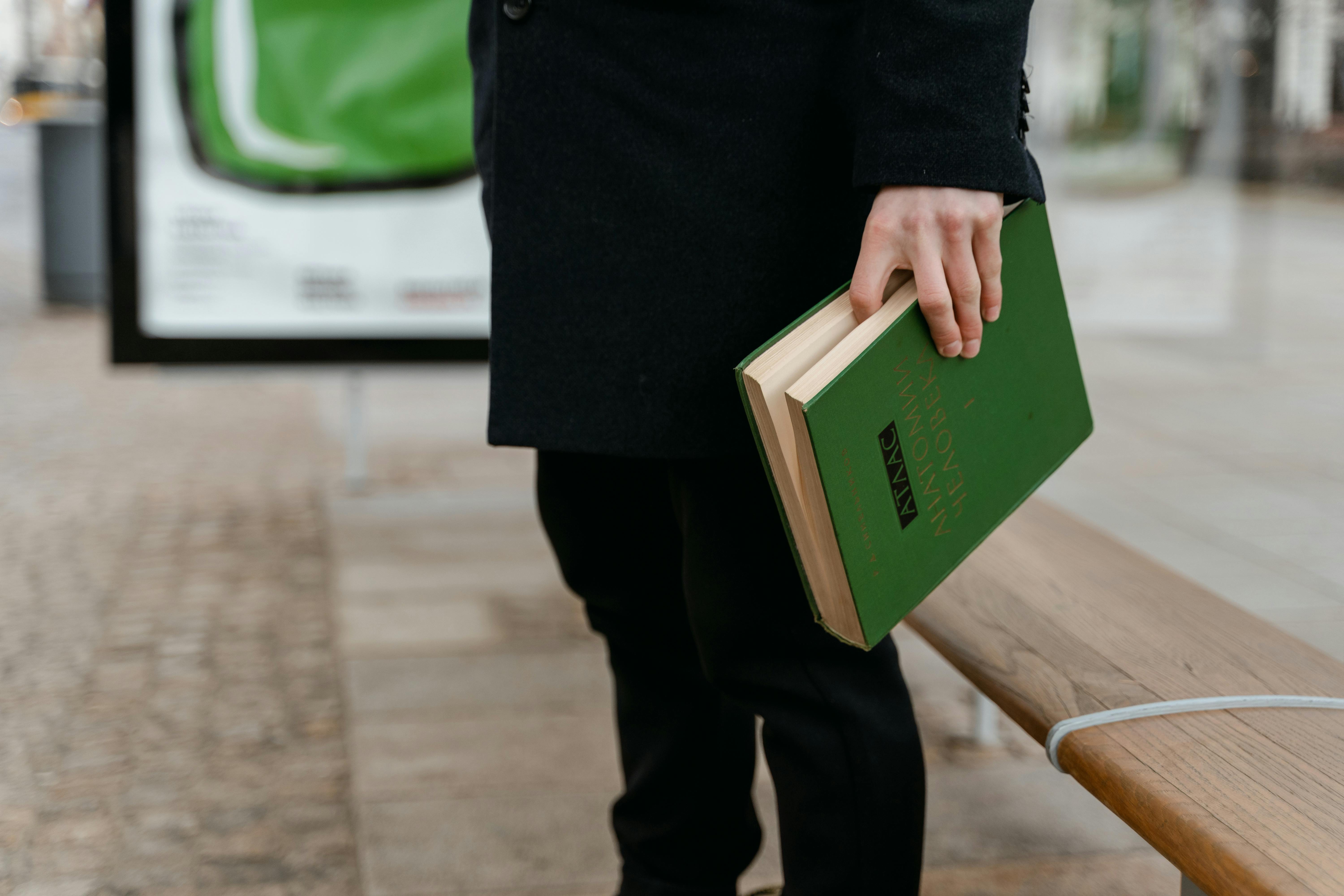 A Person Holding a Book · Free Stock Photo