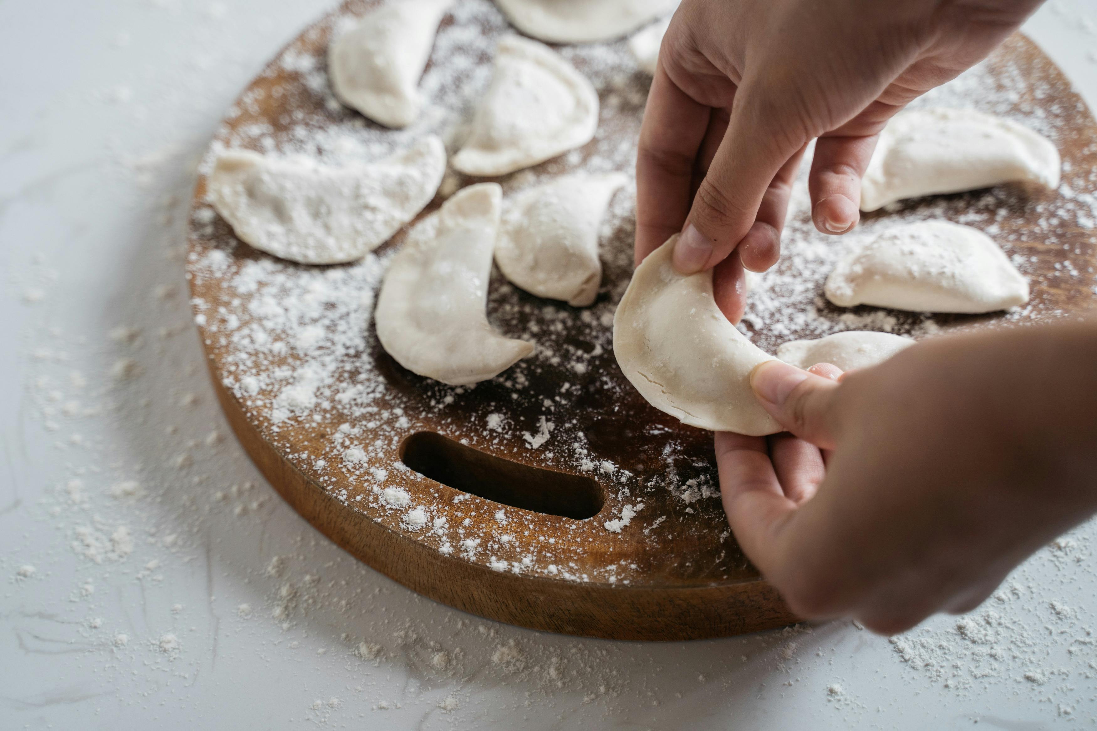 Person Preparing Dumplings · Free Stock Photo