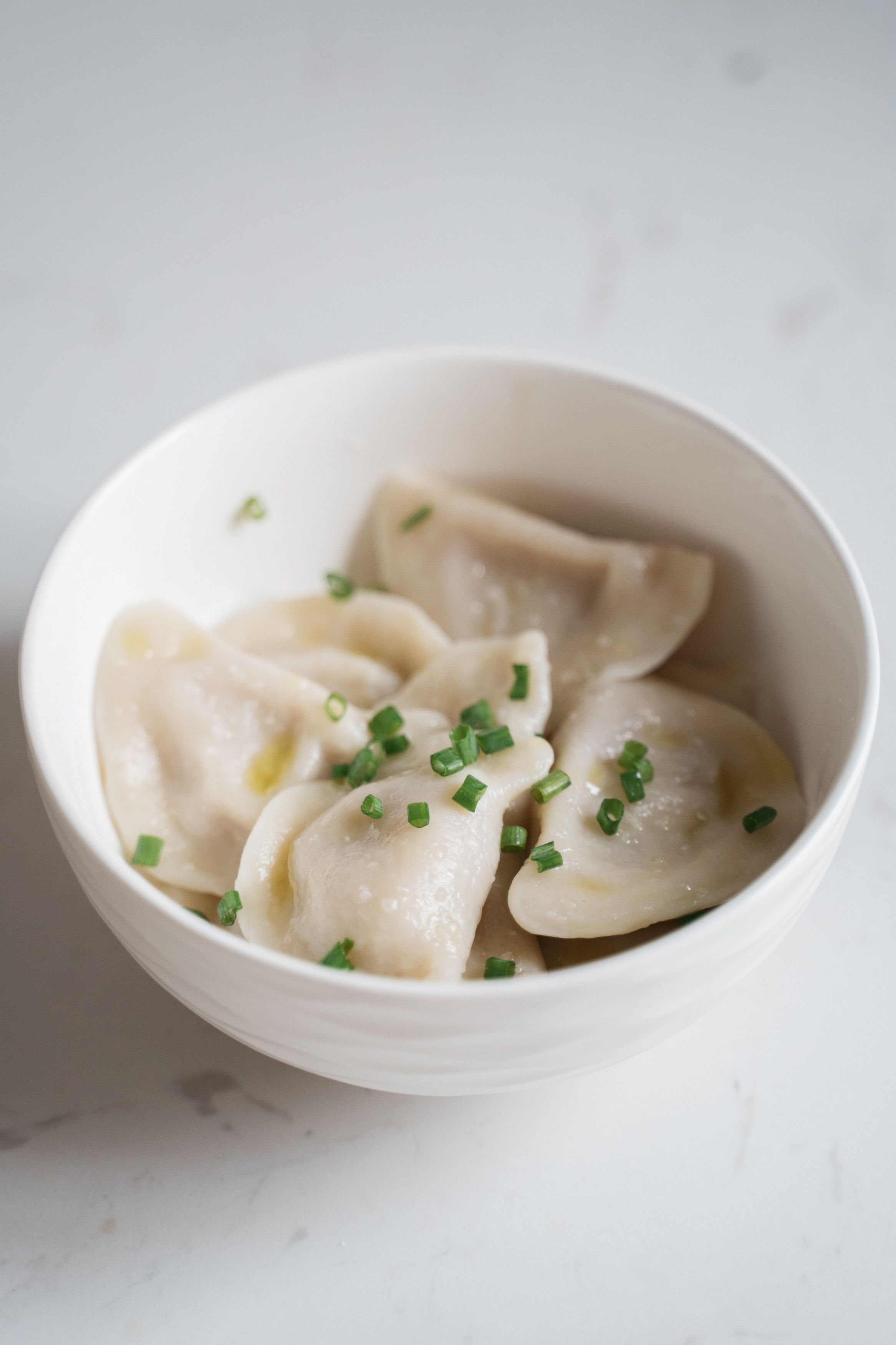 Close-Up Shot of Raw Dumplings in a Bowl · Free Stock Photo