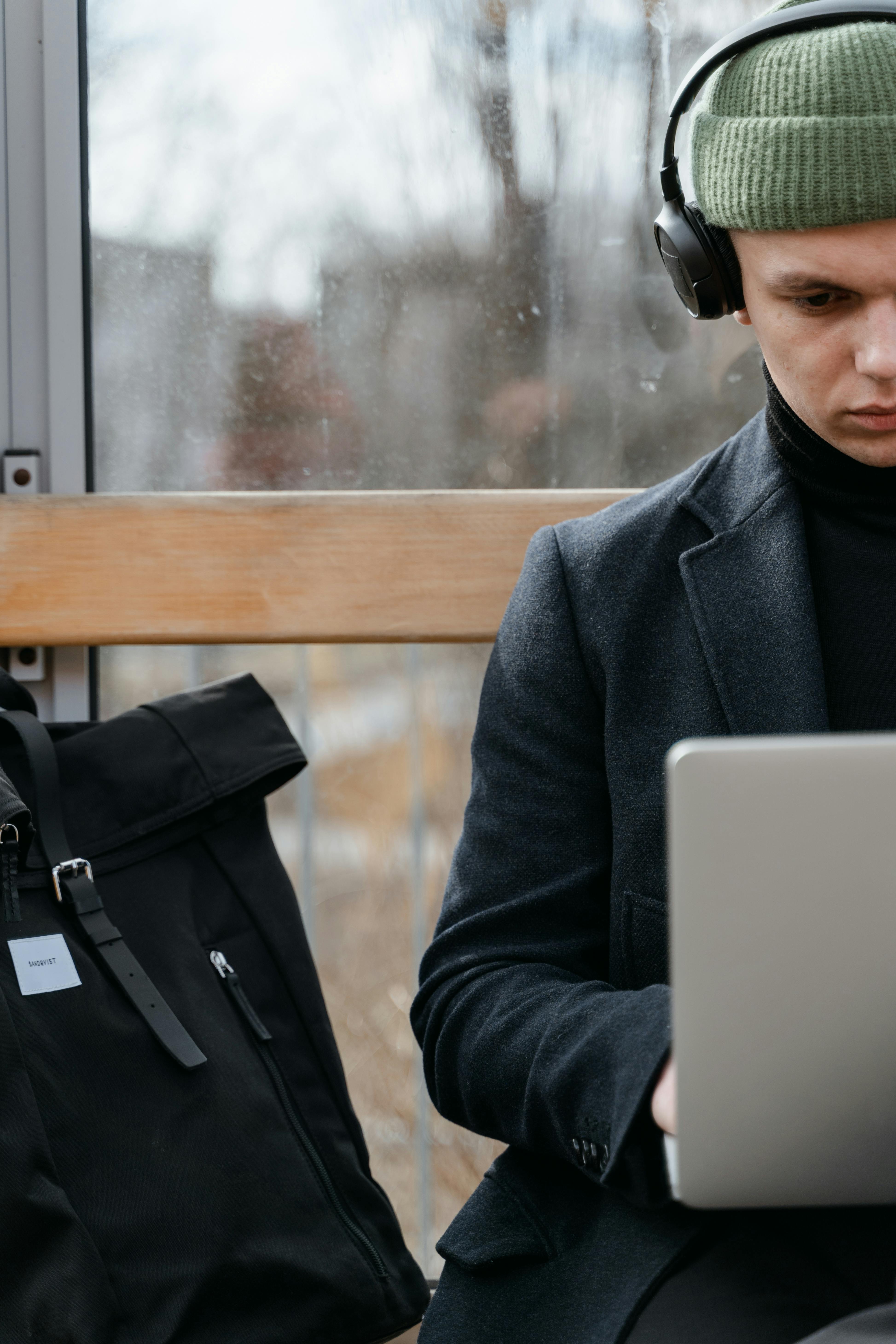 Brown Haired Man Using Laptop Computer · Free Stock Photo