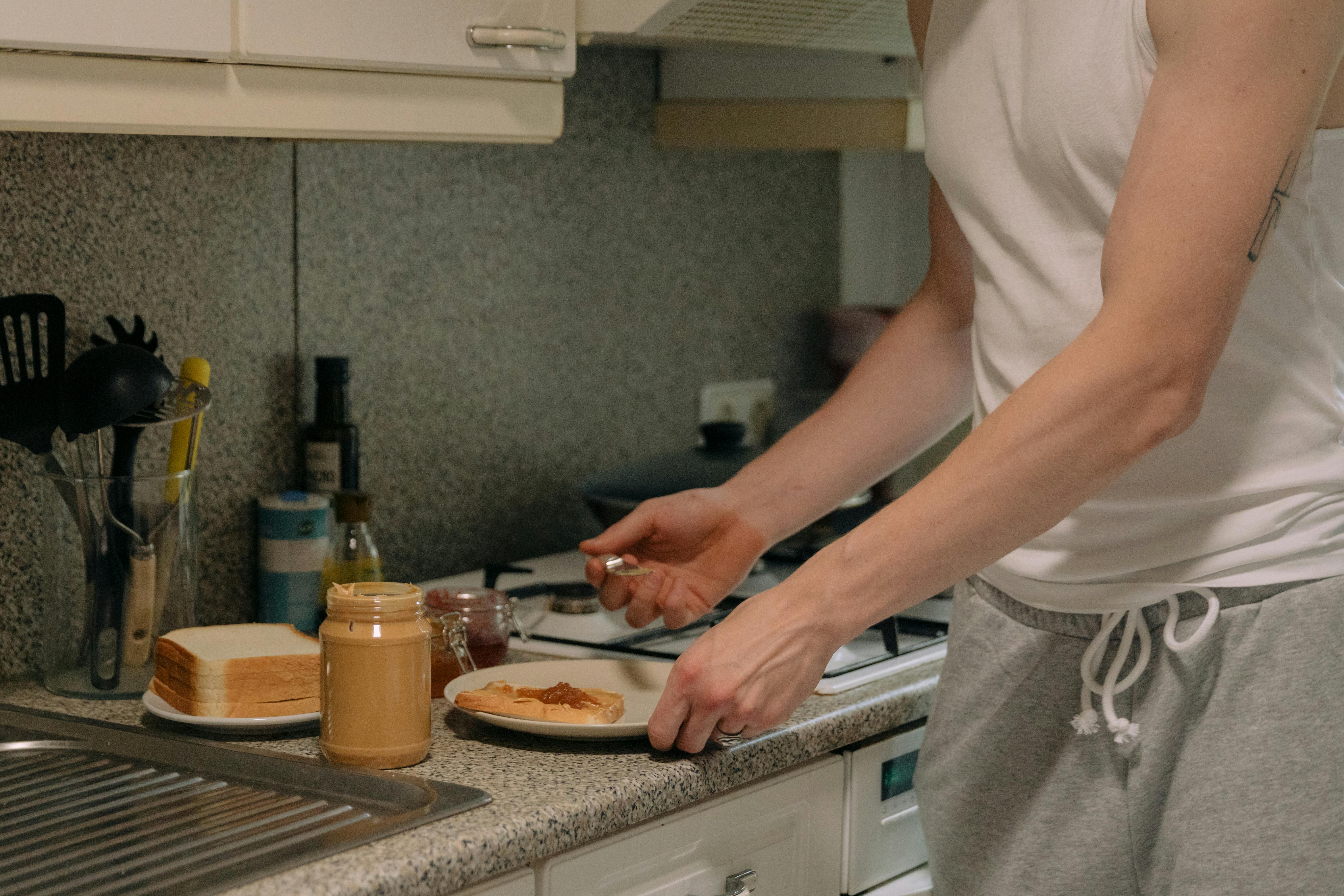 Person Preparing Food on Kitchen Counter Top · Free Stock Photo