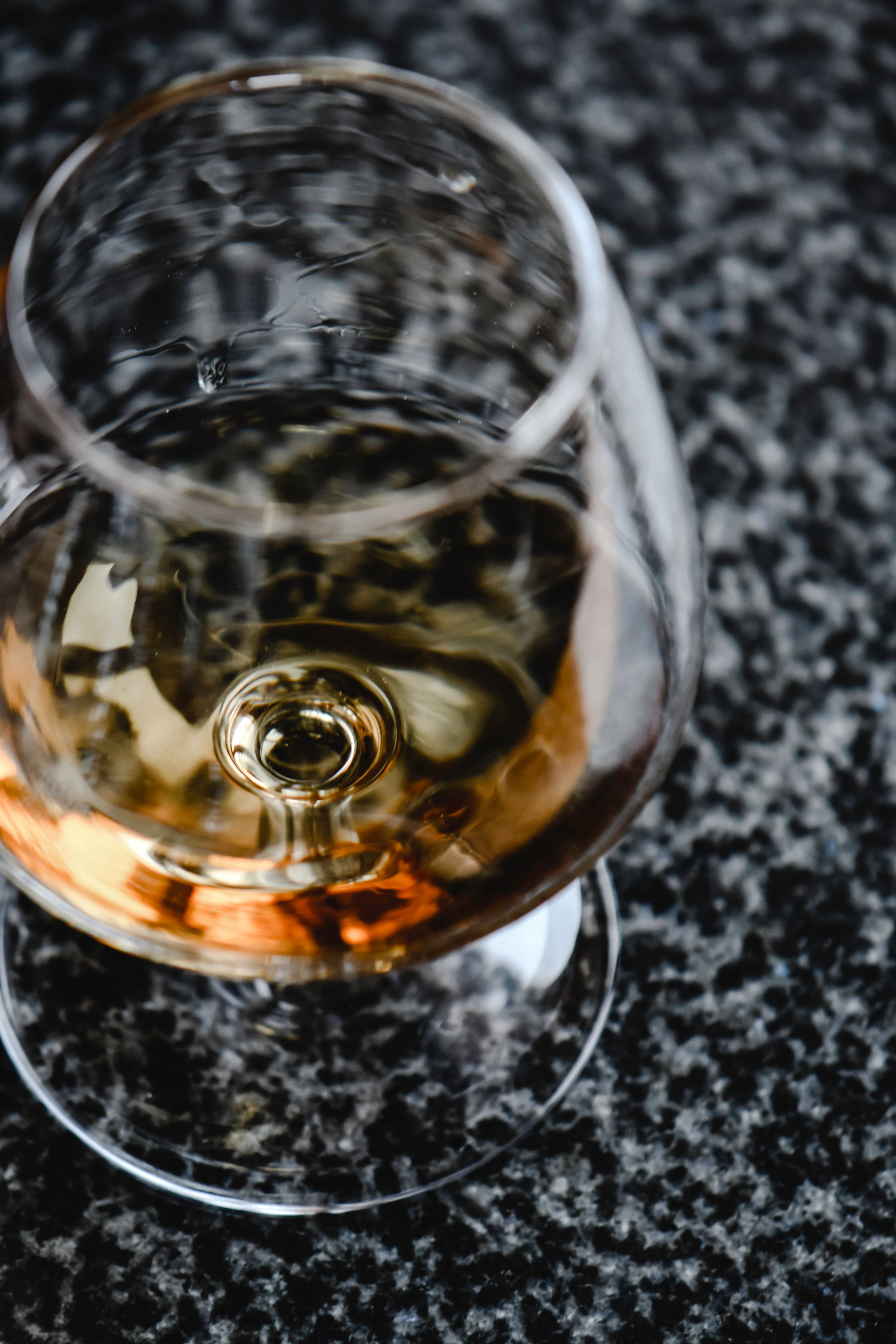 Close-Up Shot of Alcoholic Drink in Two Snifter Glasses · Free Stock Photo