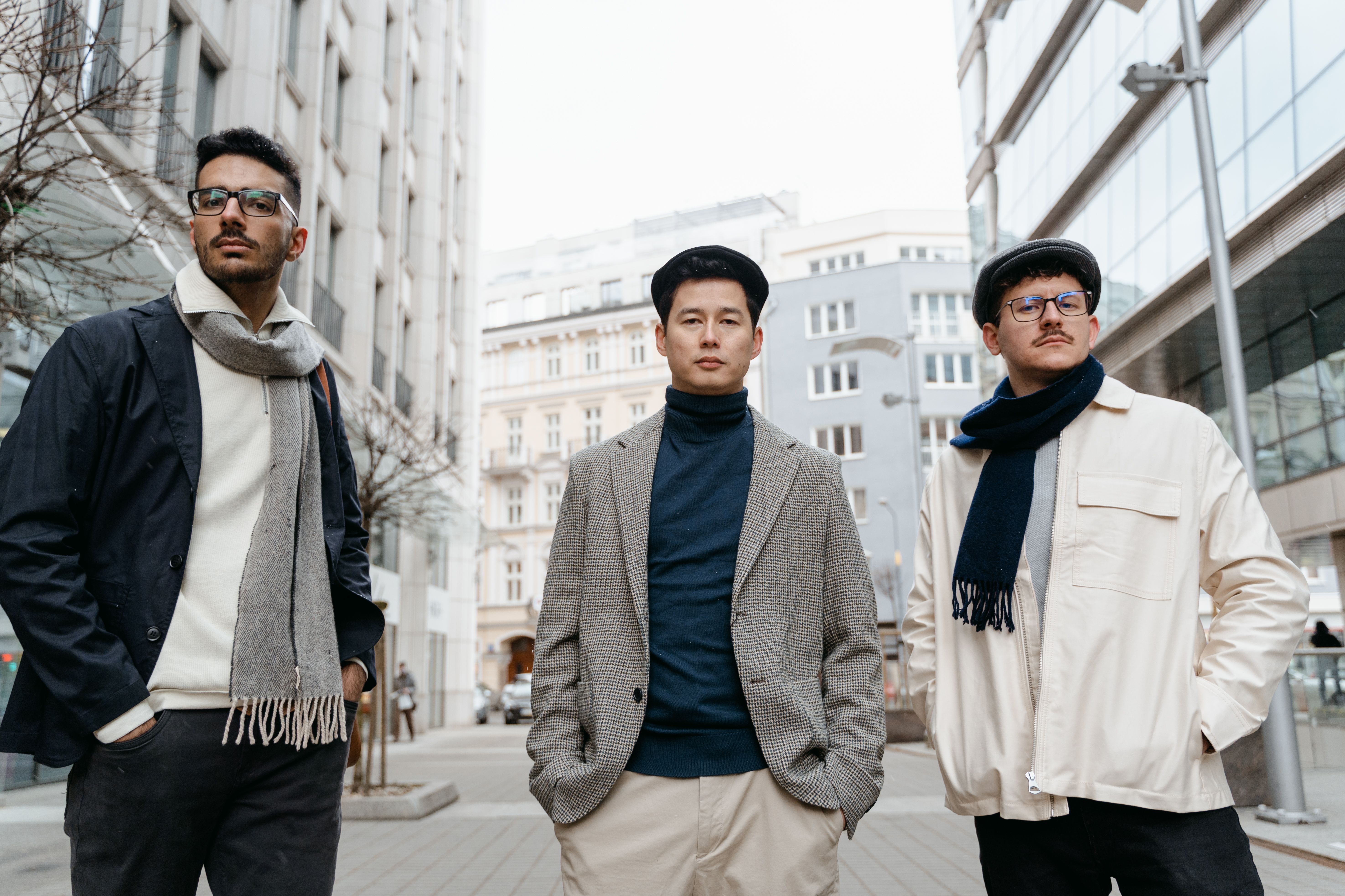 A Group of Men Standing on the Street while Looking with a Serious Face ...
