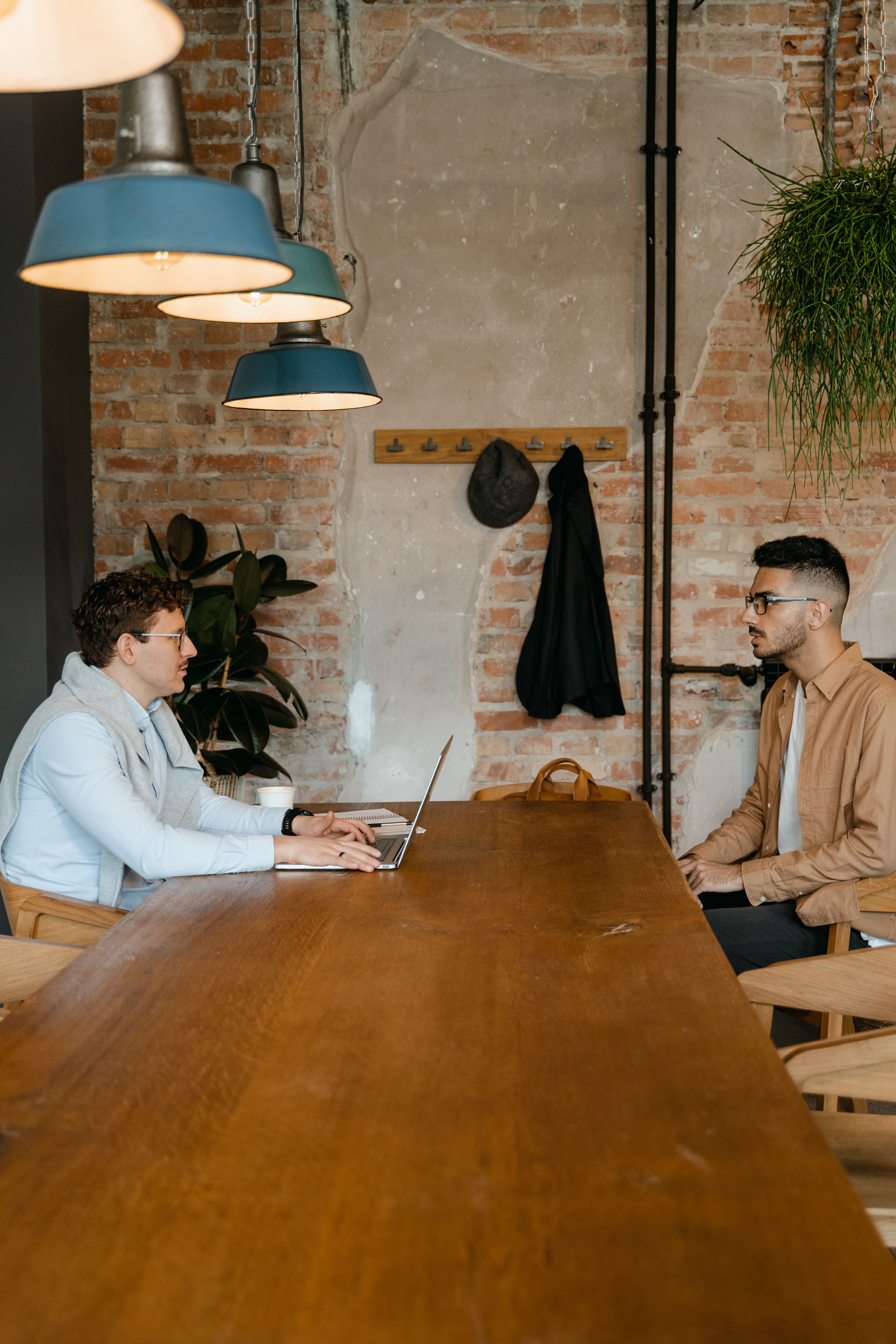 A Man Interviewing an Applicant · Free Stock Photo