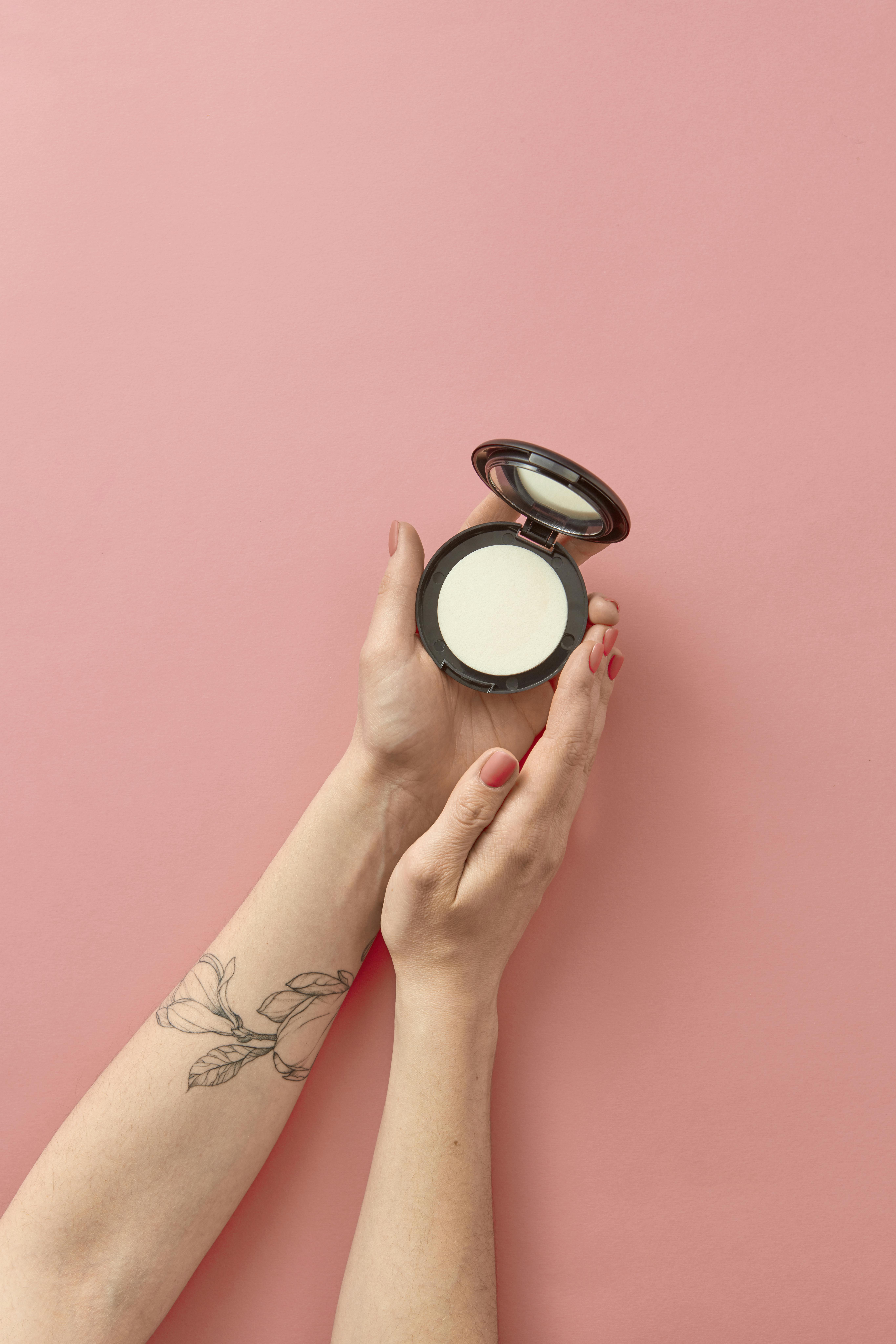 A Person Holding a Compact Mirror · Free Stock Photo