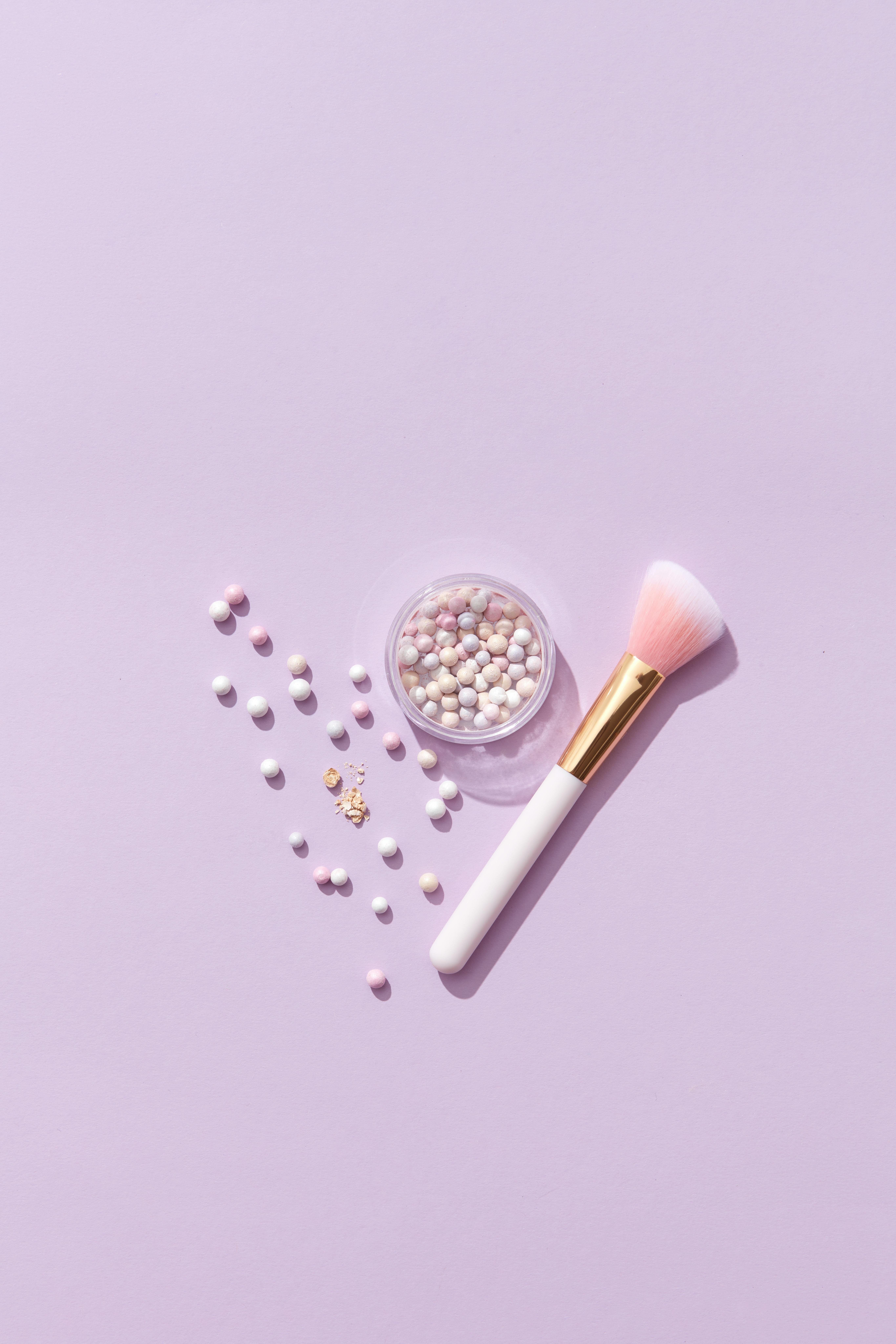Cosmetics Makeup Brushes and Powder Dust Explosion · Free Stock Photo