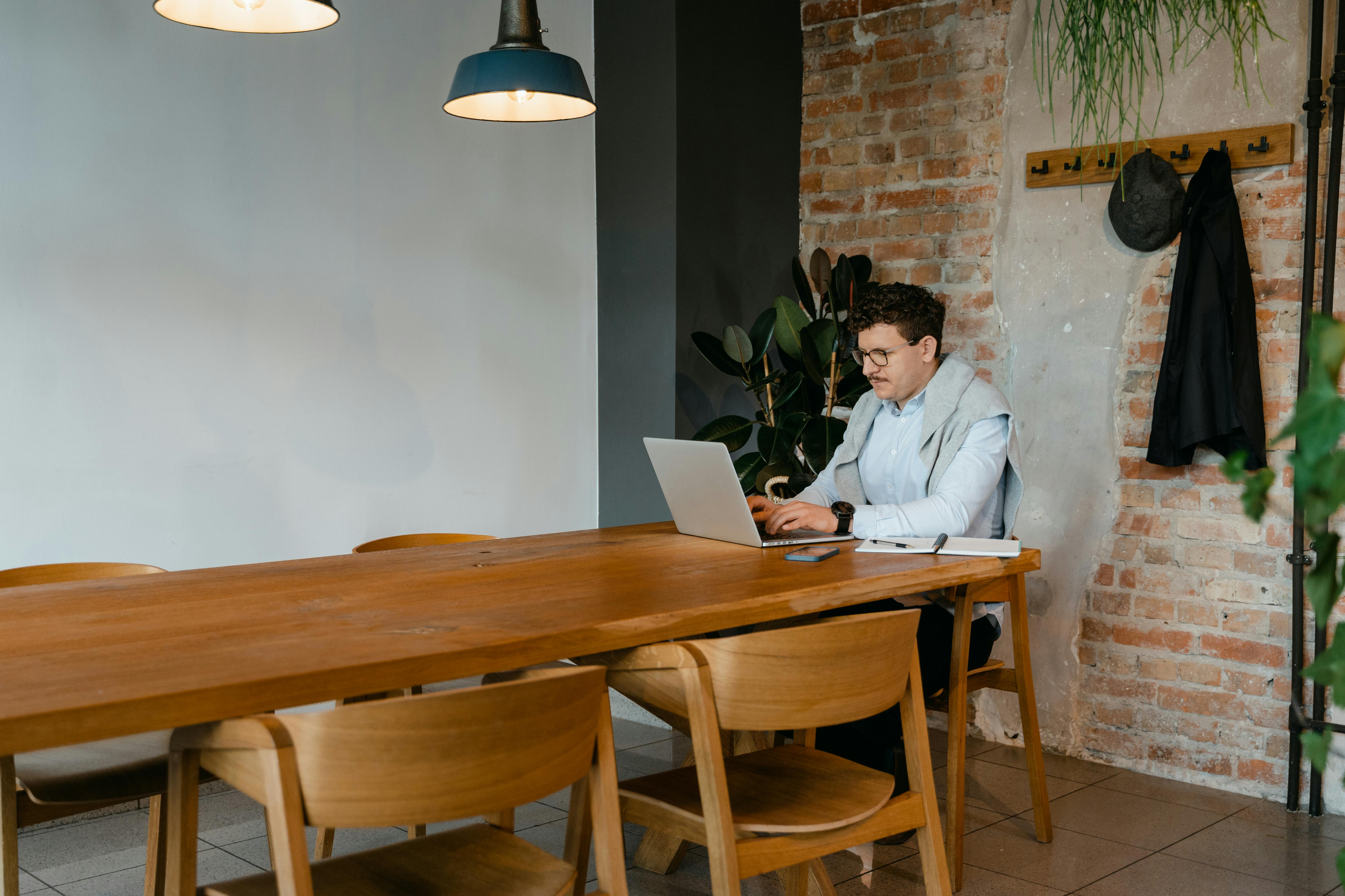 Focused Woman working using Laptop · Free Stock Photo