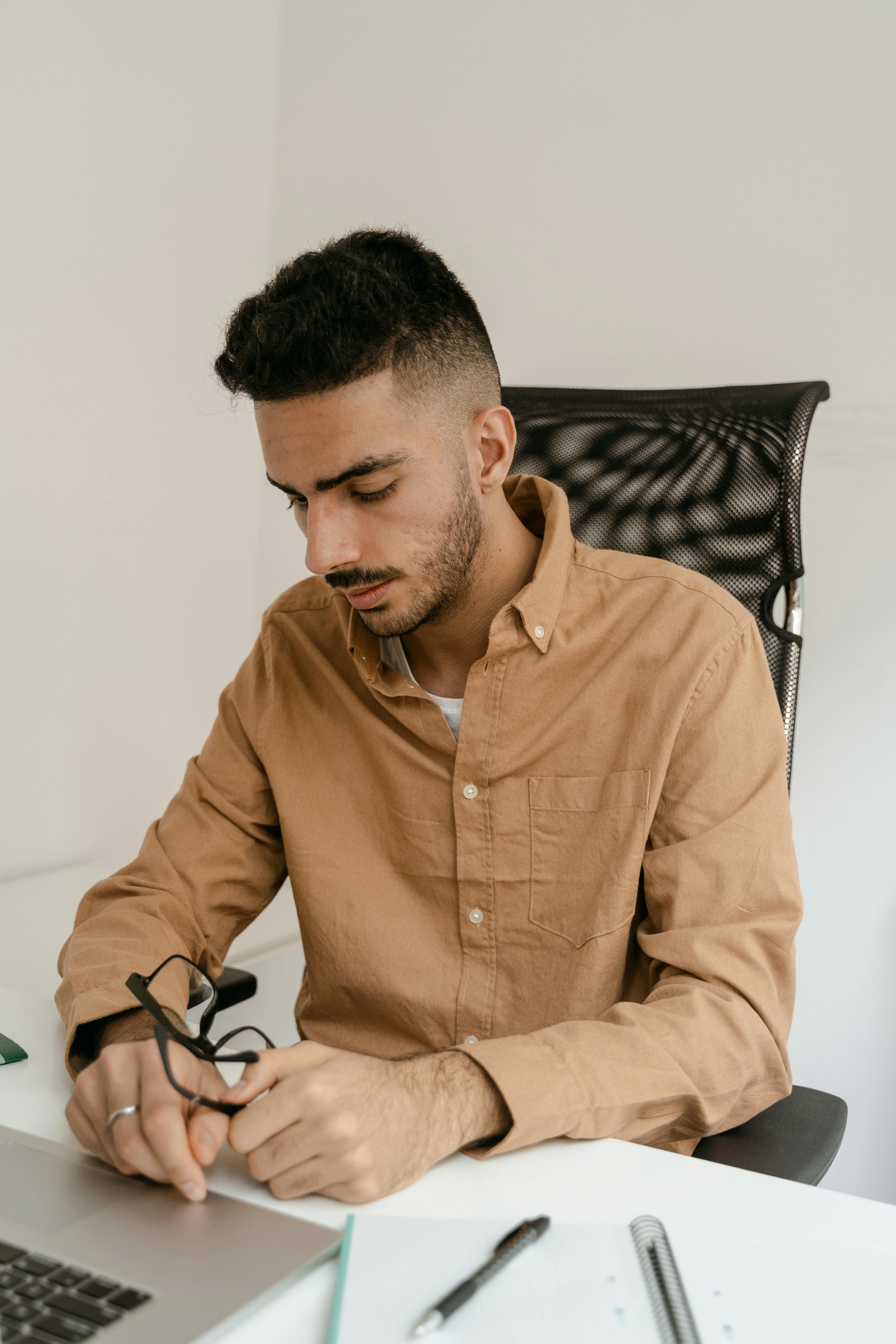 A Working Man Behind a Desk · Free Stock Photo